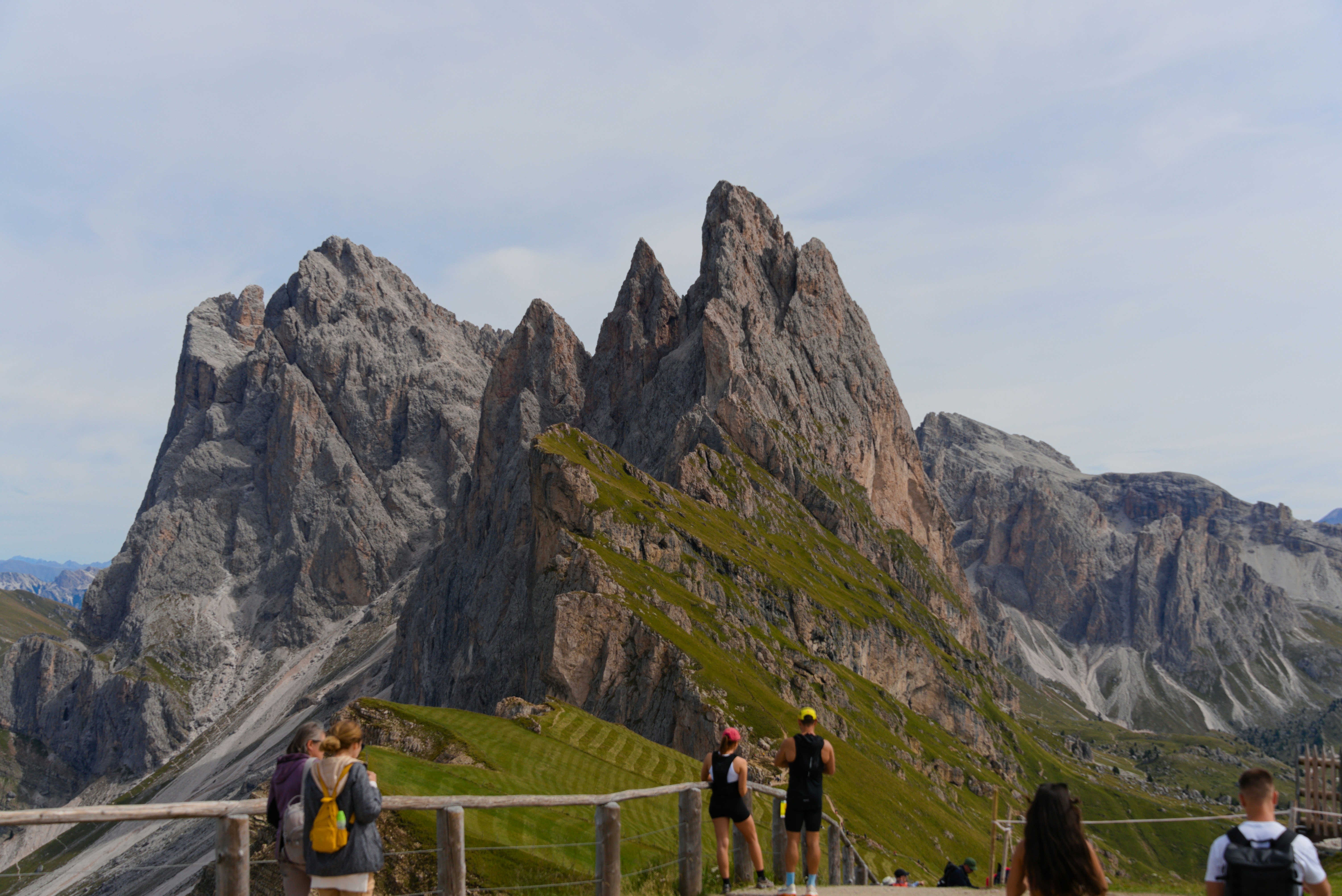 Ridgeline of Peaks: Hikers Amidst Jagged Monoliths
