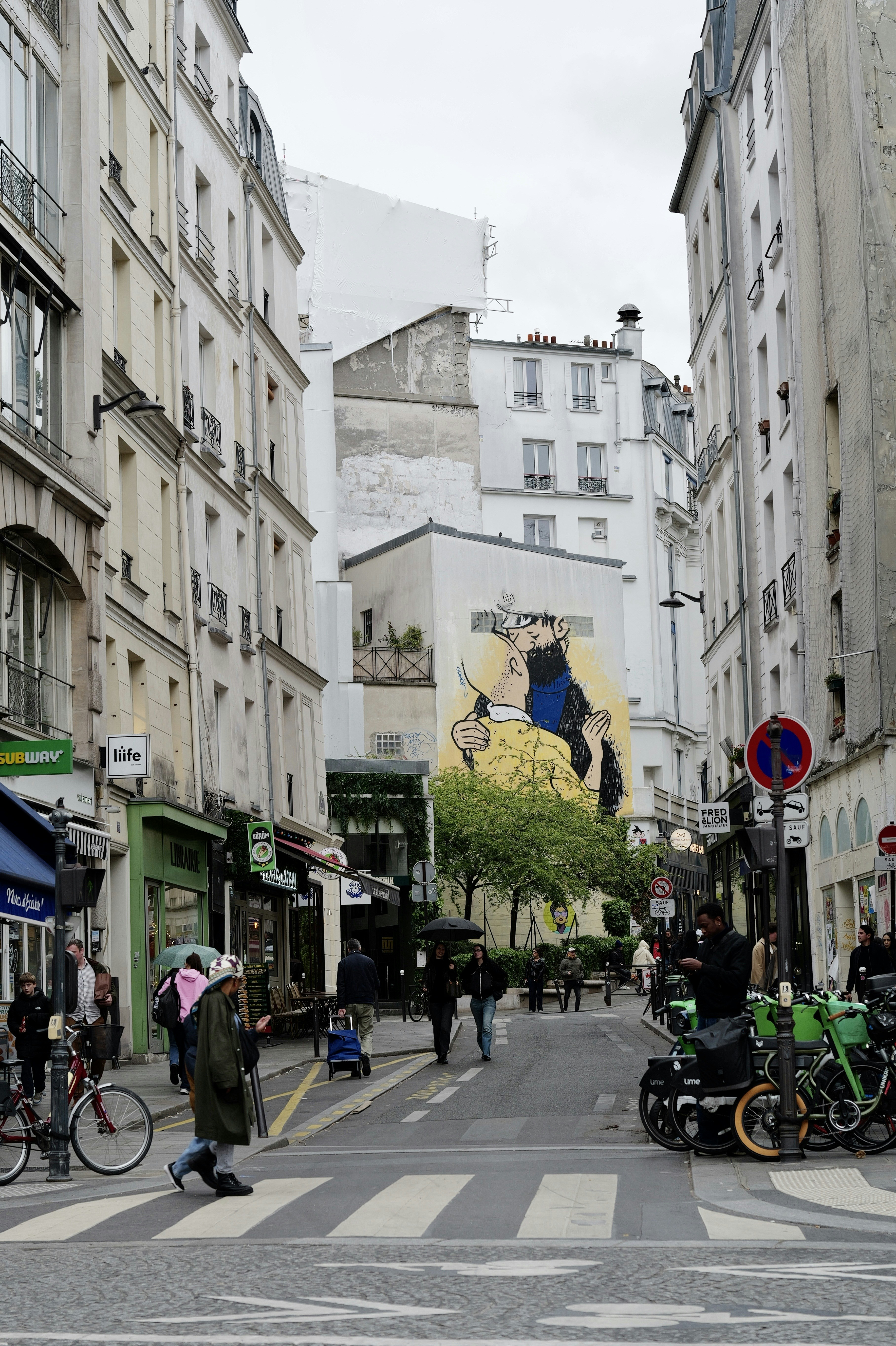 Mural Backbone: A City Street Framed by Opposing Heights