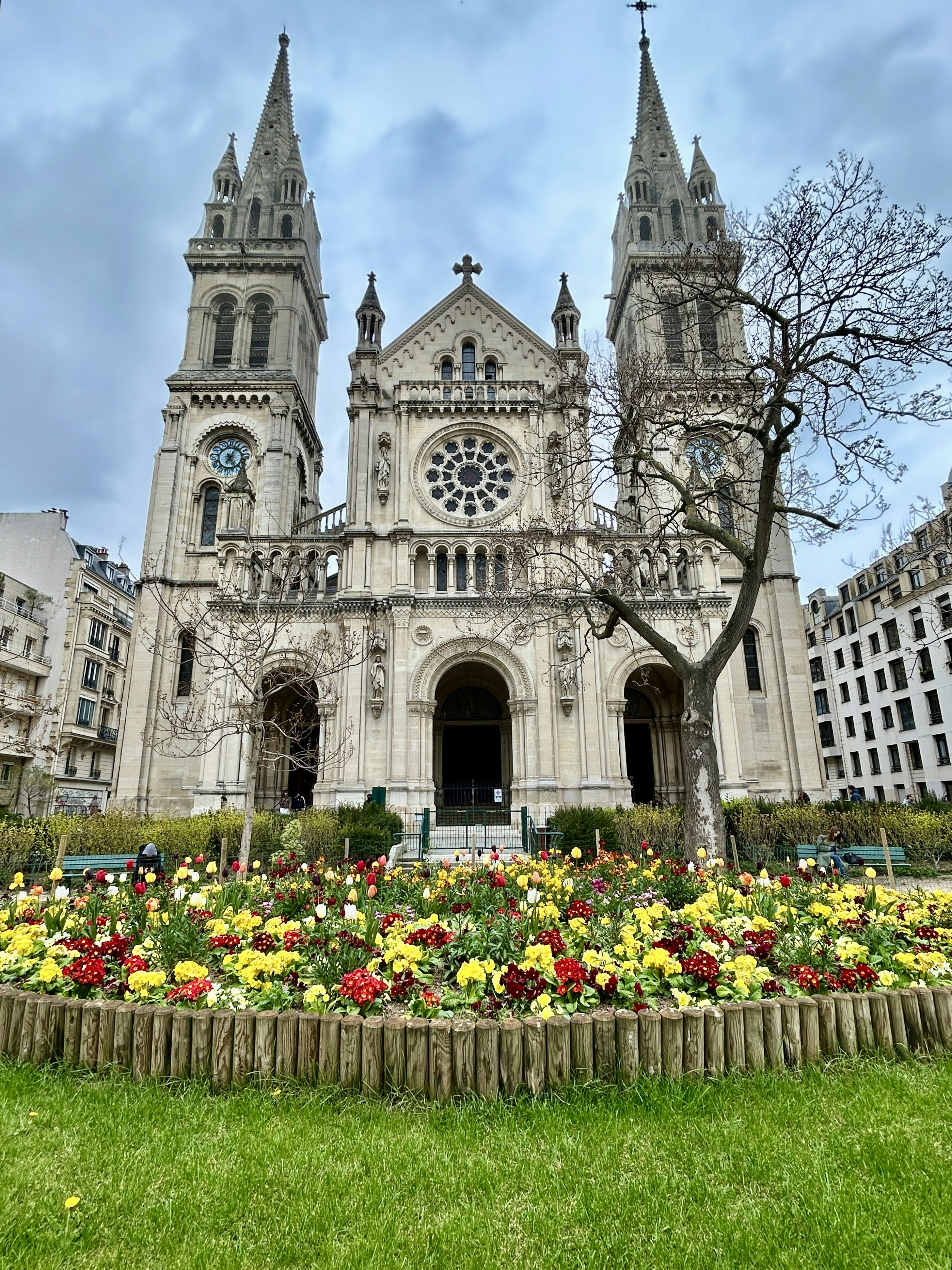 Saints and Bouquets: A Gothic Cathedral Framed by Spring Gardens