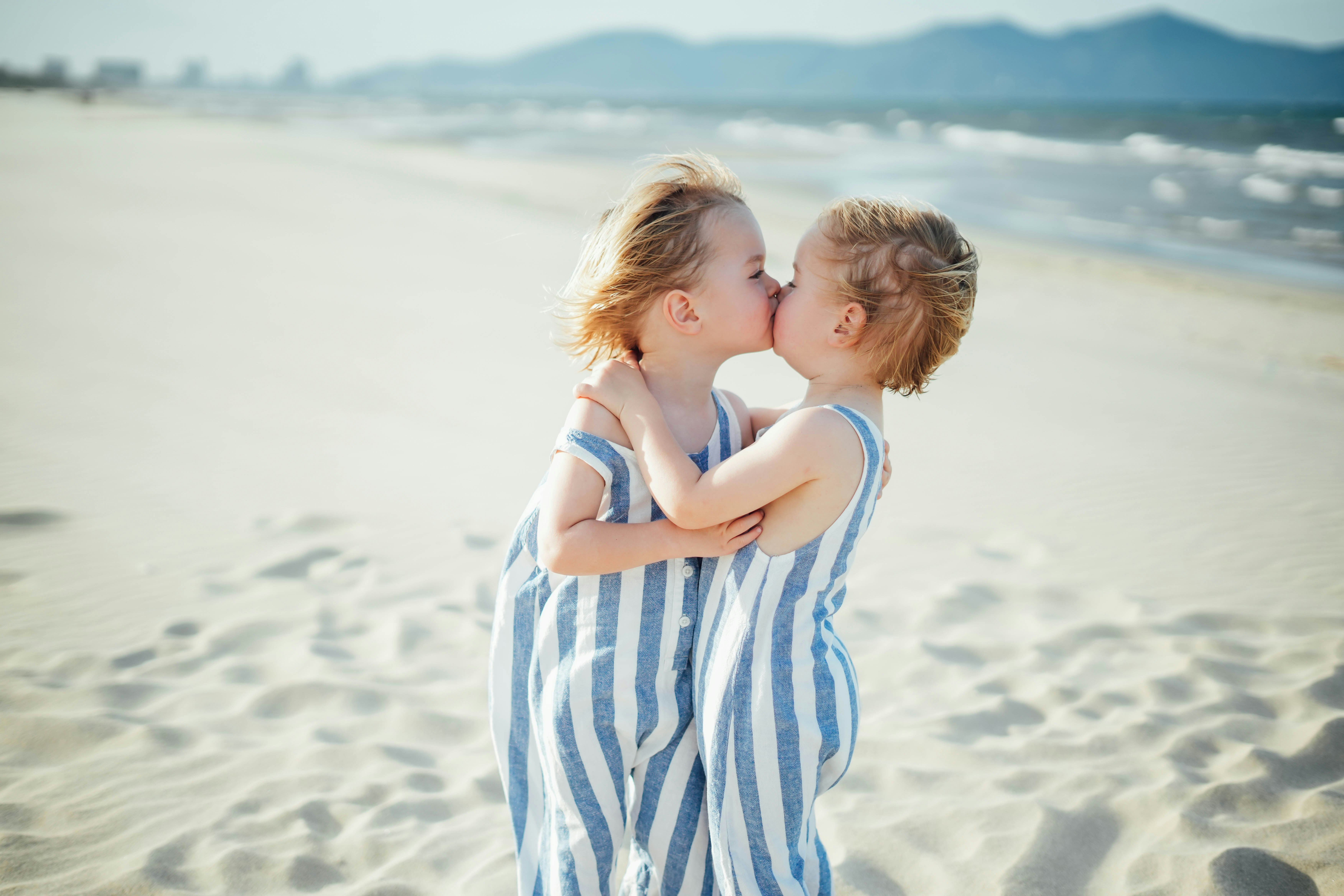 Beachside Kiss: Twin Stripes Embrace under Coastal Light