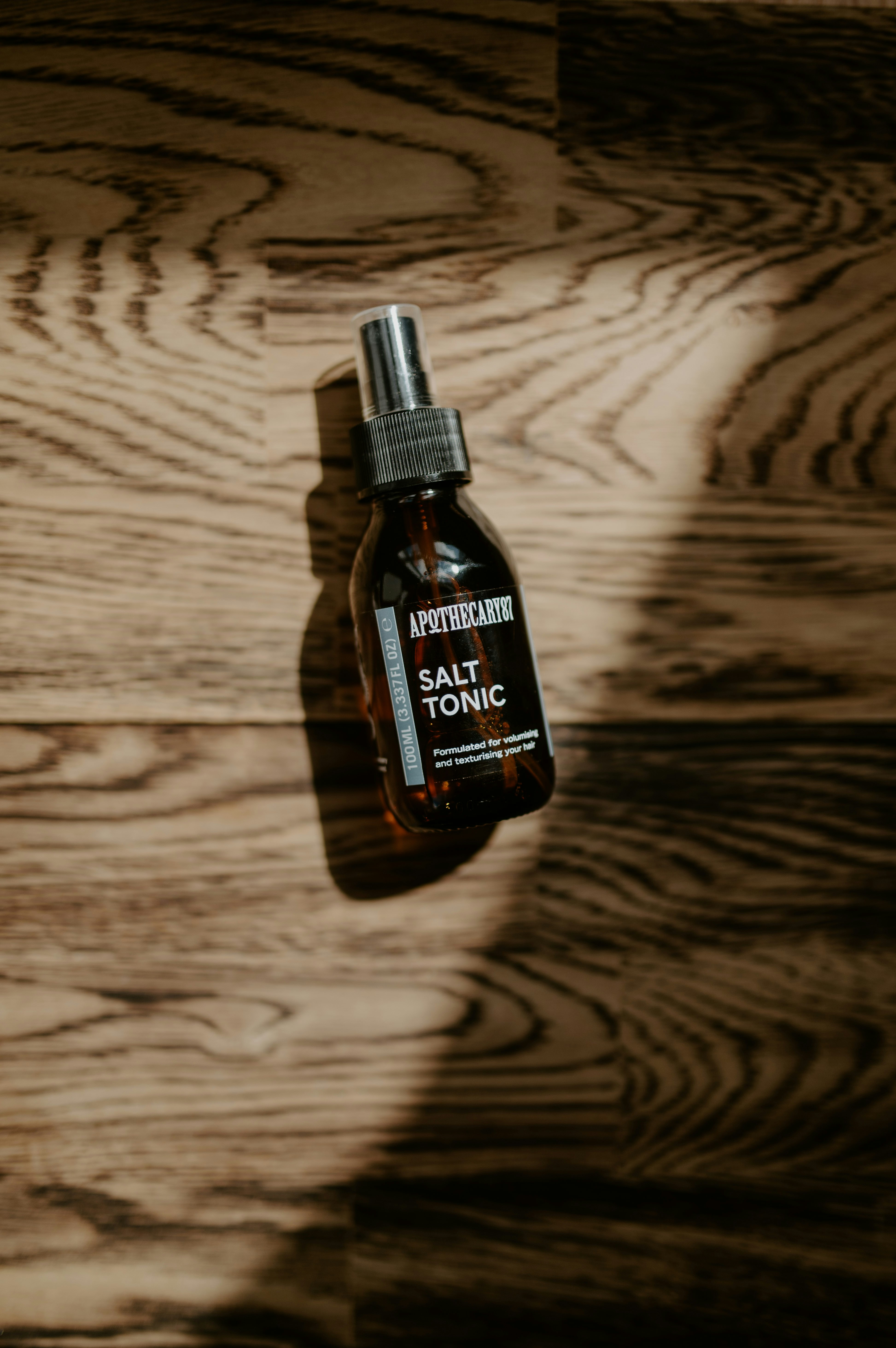  Apothecary Bottle on Ornate Woodgrain