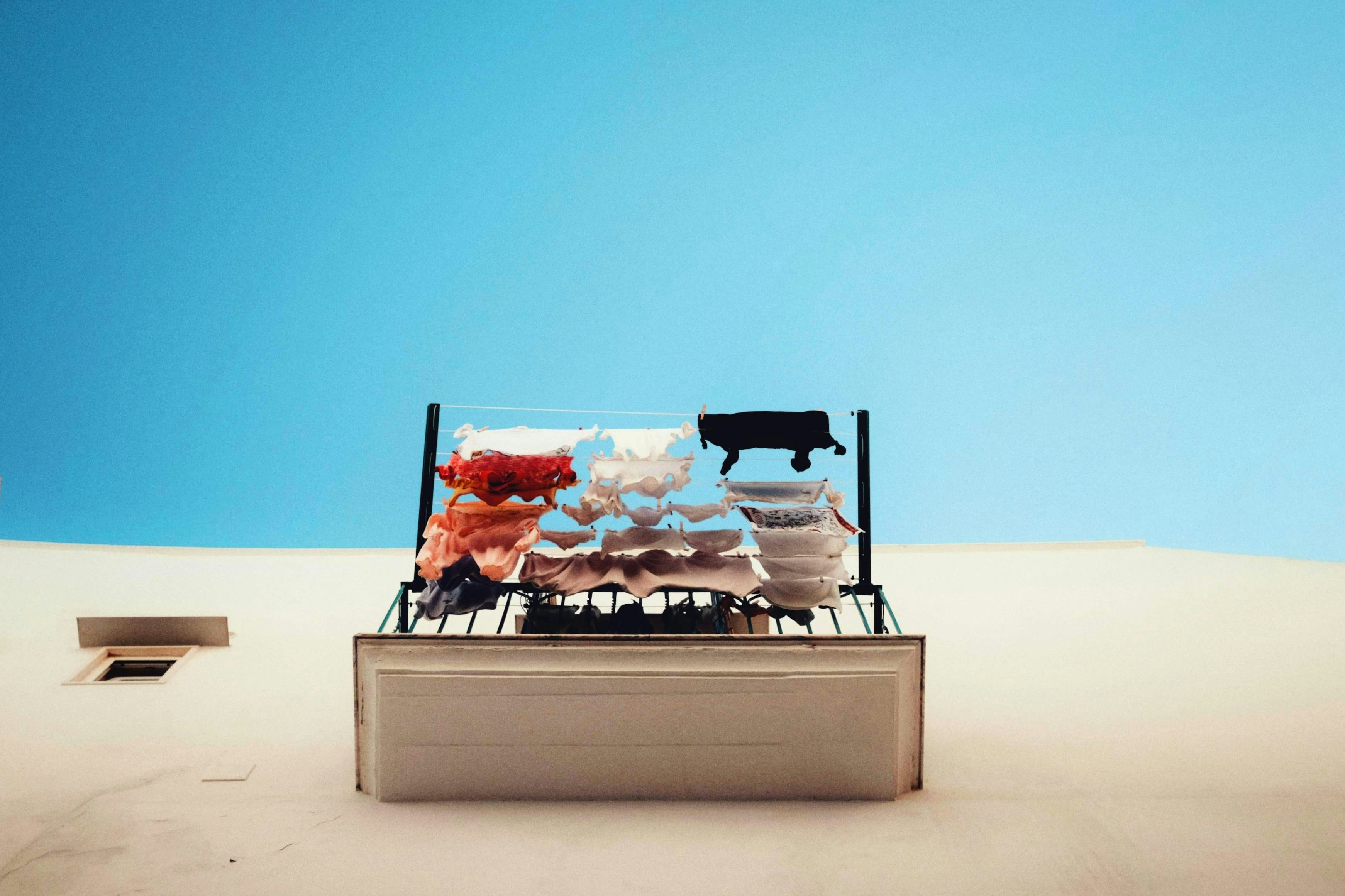 Laundry Array Adrift Above a Sunlit Balcony