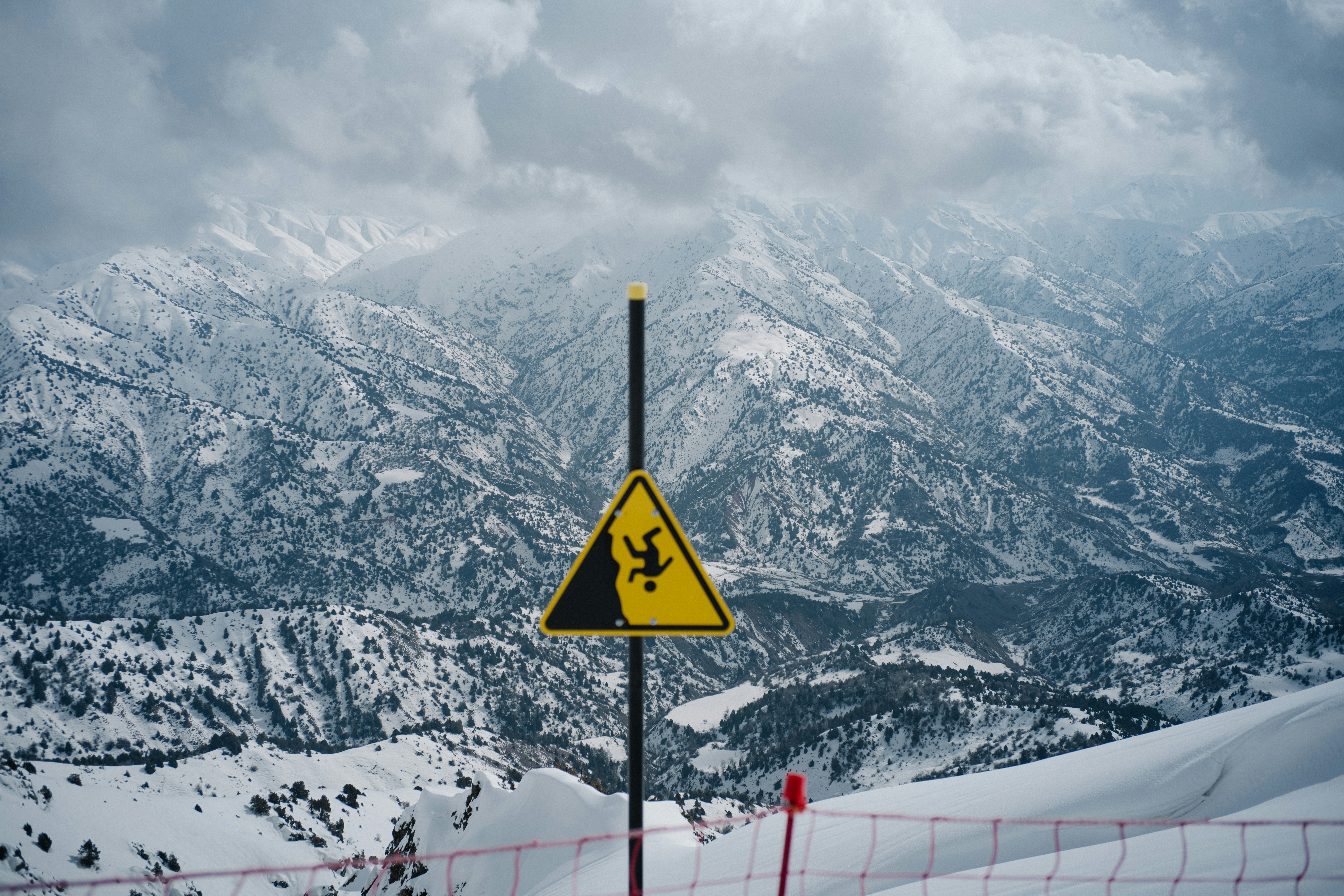 Snowbound Signpost: A Warning Amidst the Alpine Silence
