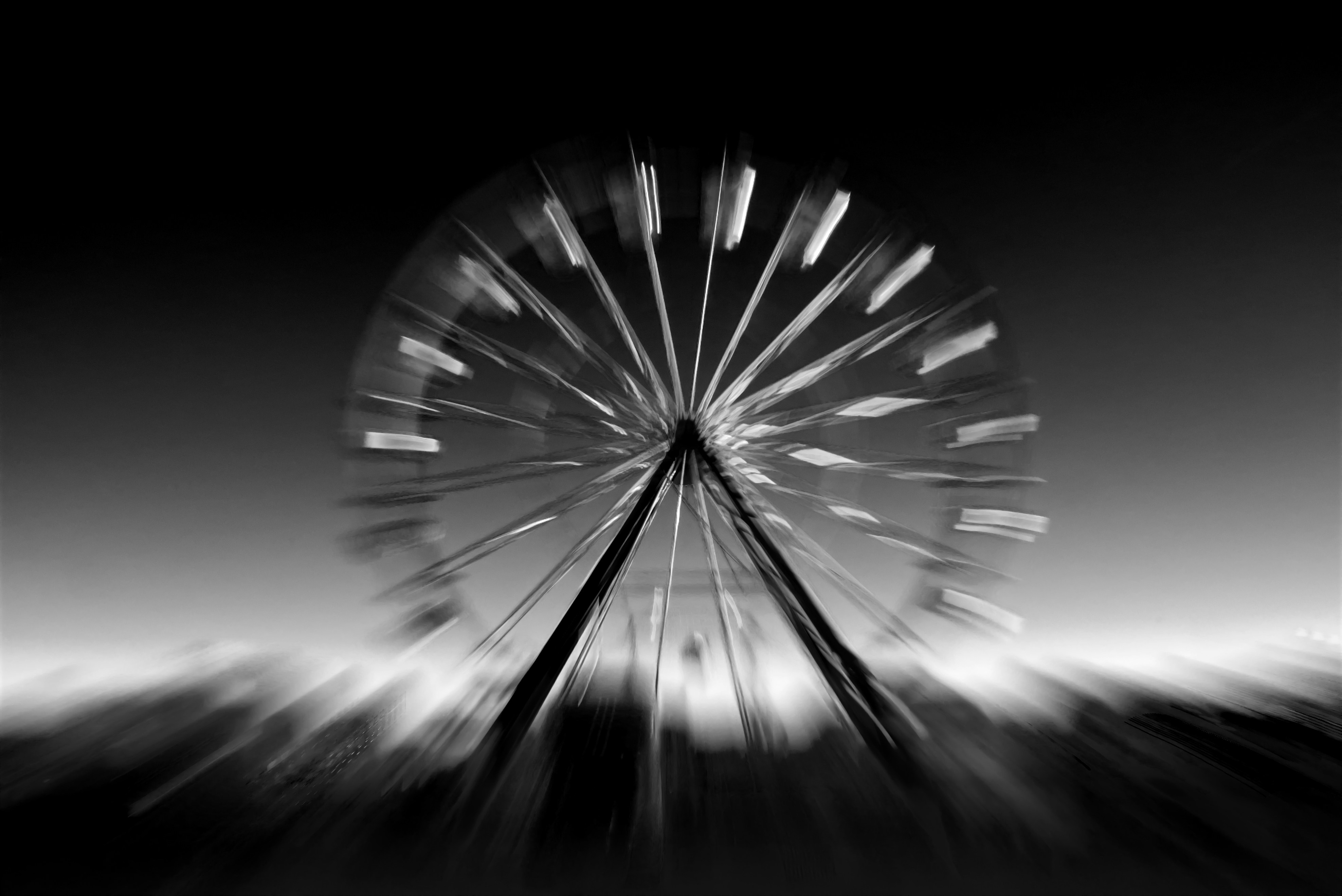 Radial Blur at Dusk: A Ferris Wheel in Motion