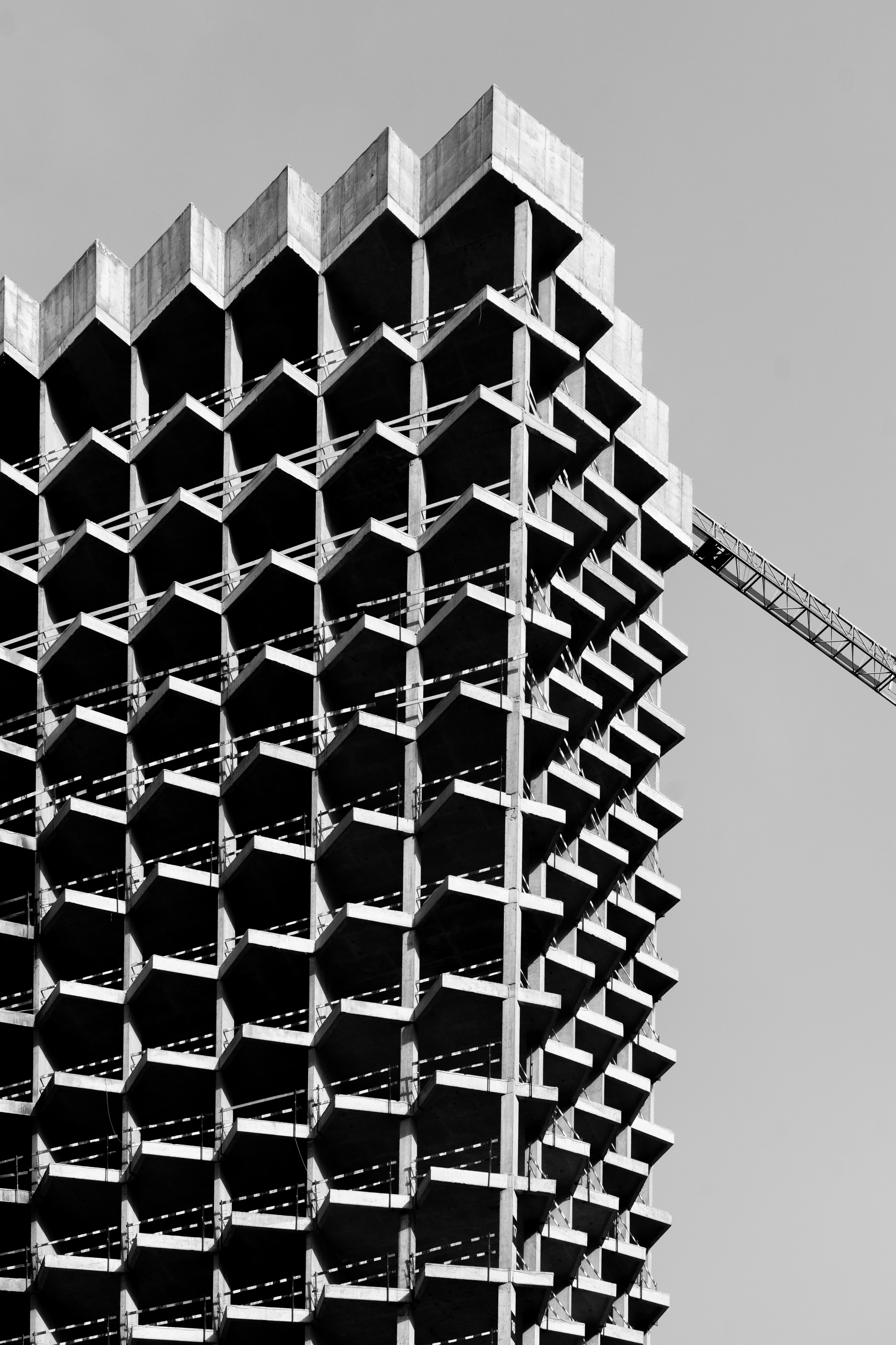 Hexagonal Echo: Concrete Lattice rises against a clear sky