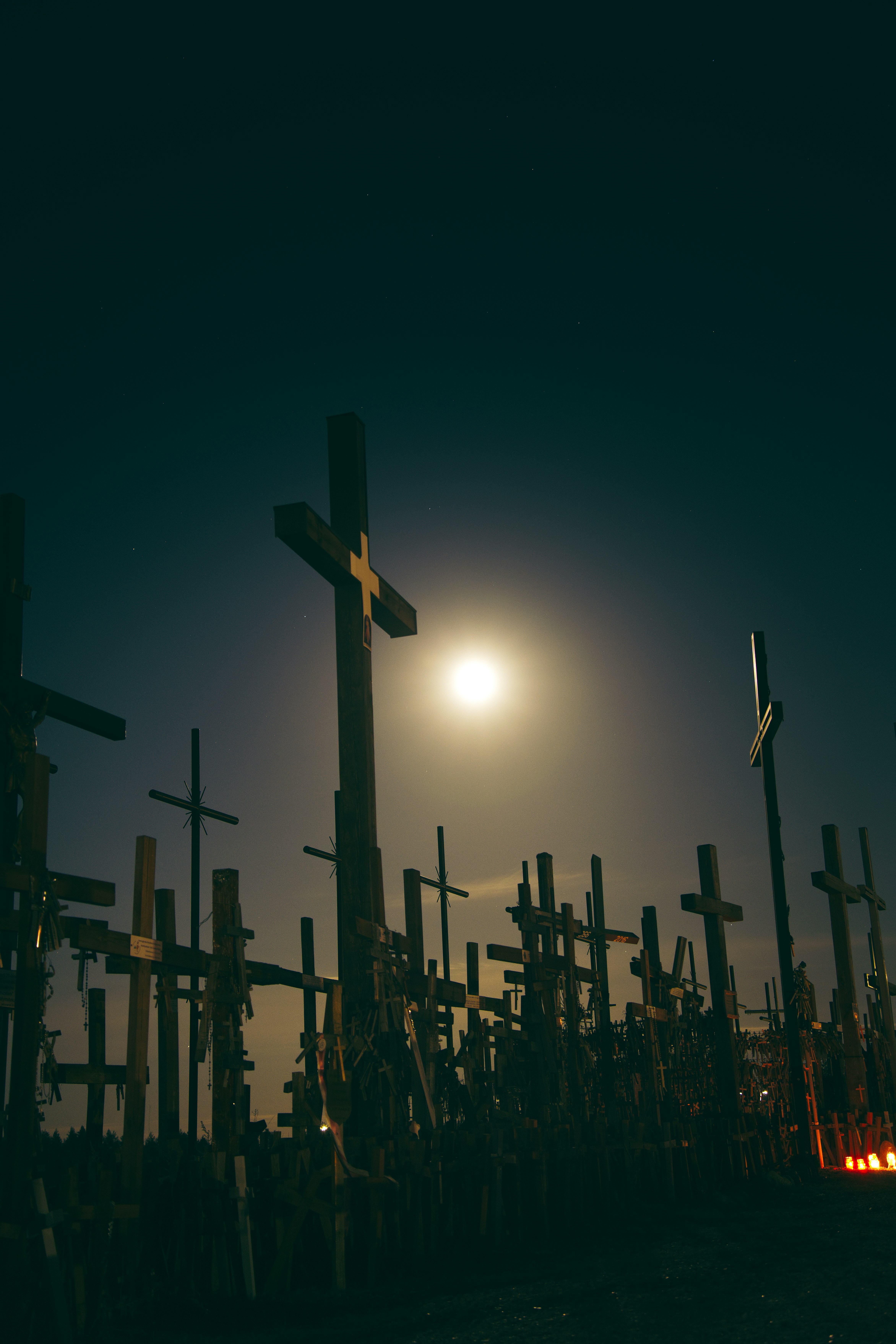 Moonlit Crossing: Rows of Crosses under a Silent Night