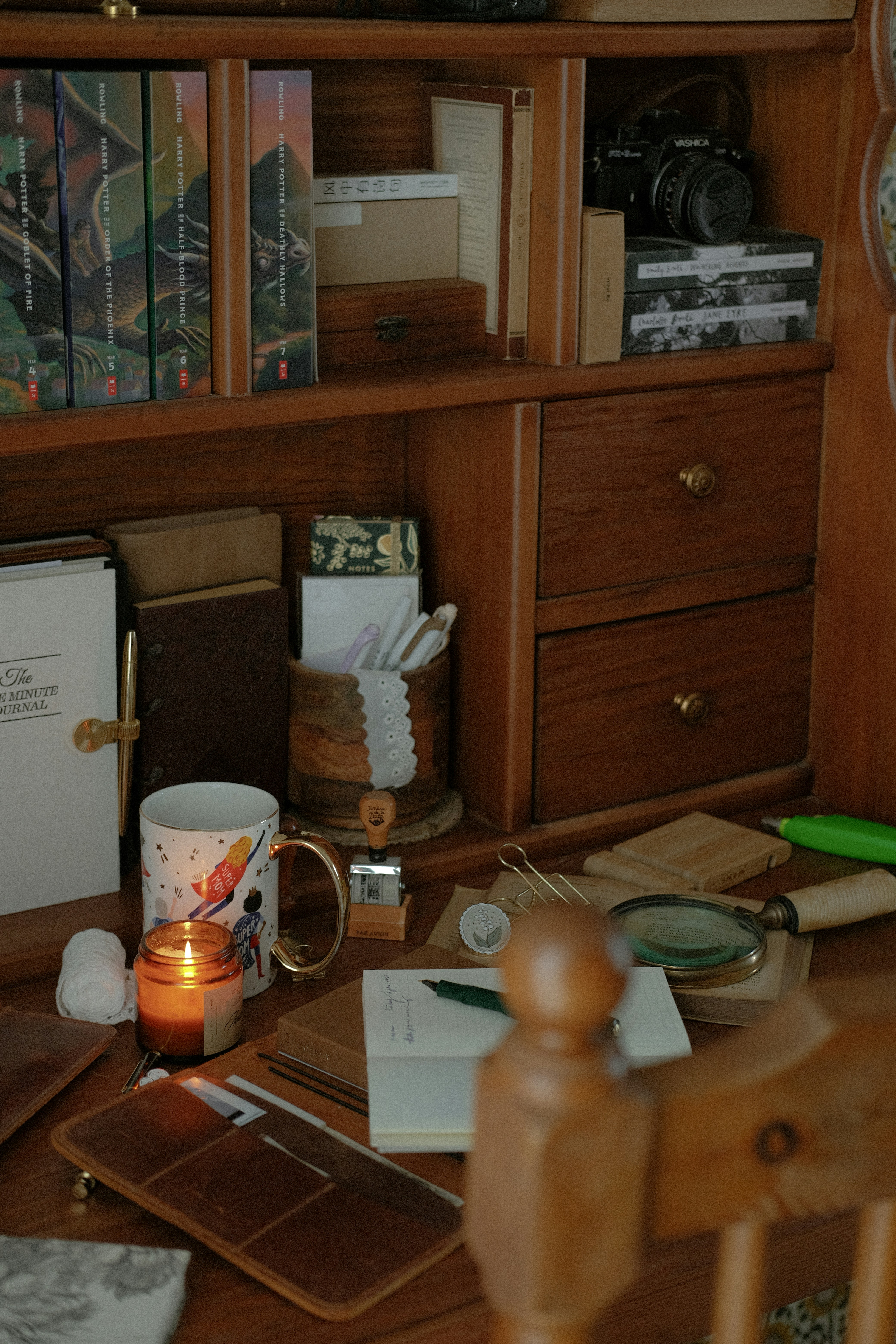A Quiet Desk Beneath a Wooden Wall of Keepsakes