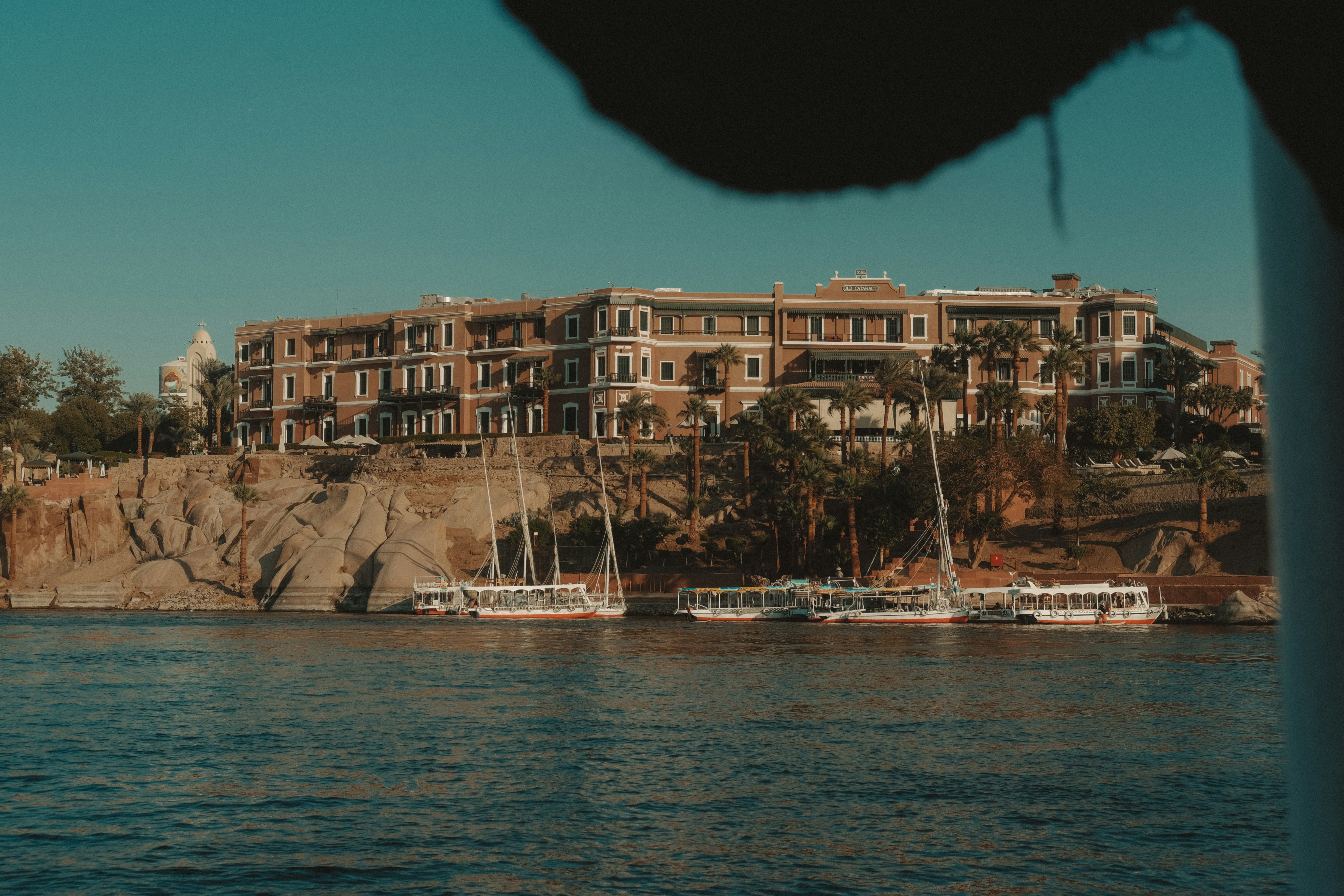 Coastal Terrace: Boats by a Villa-Bordered Shorefront
