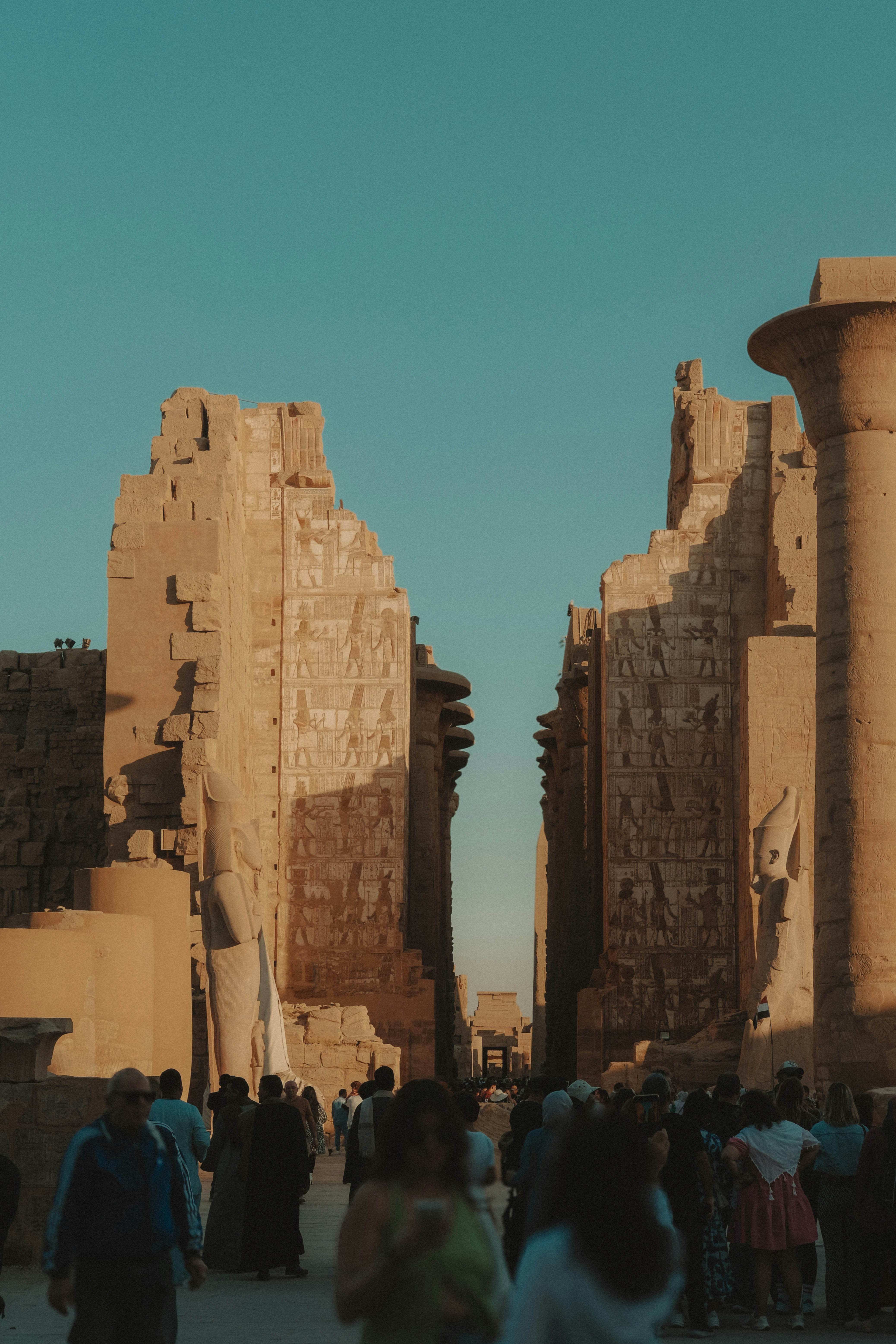 Columns of Time: A Sunlit Avenue Through Ancient Gates