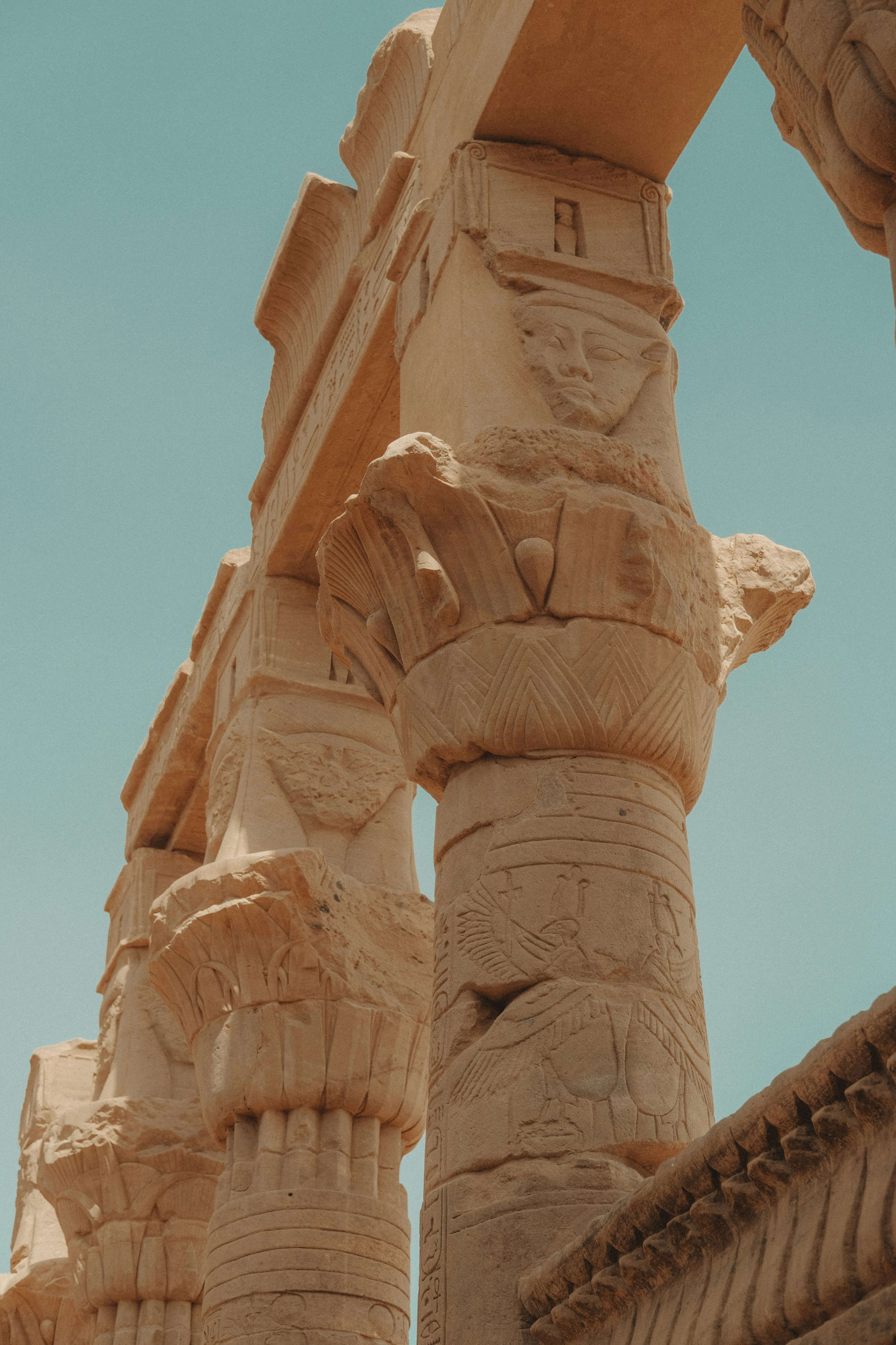 Stone Carved Colonnade Reaching Toward a Clear Sky