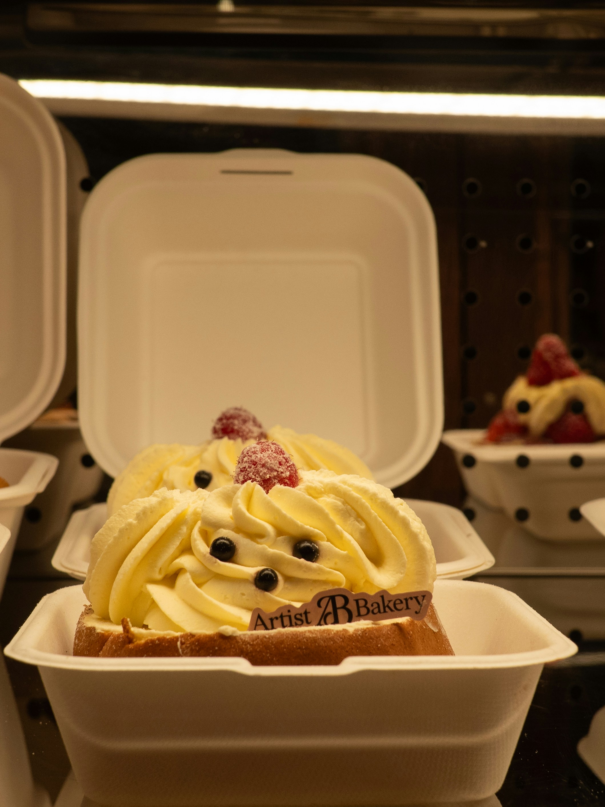 Cream Swirl Crown: A Bakery Delight in Soft Storefront Light