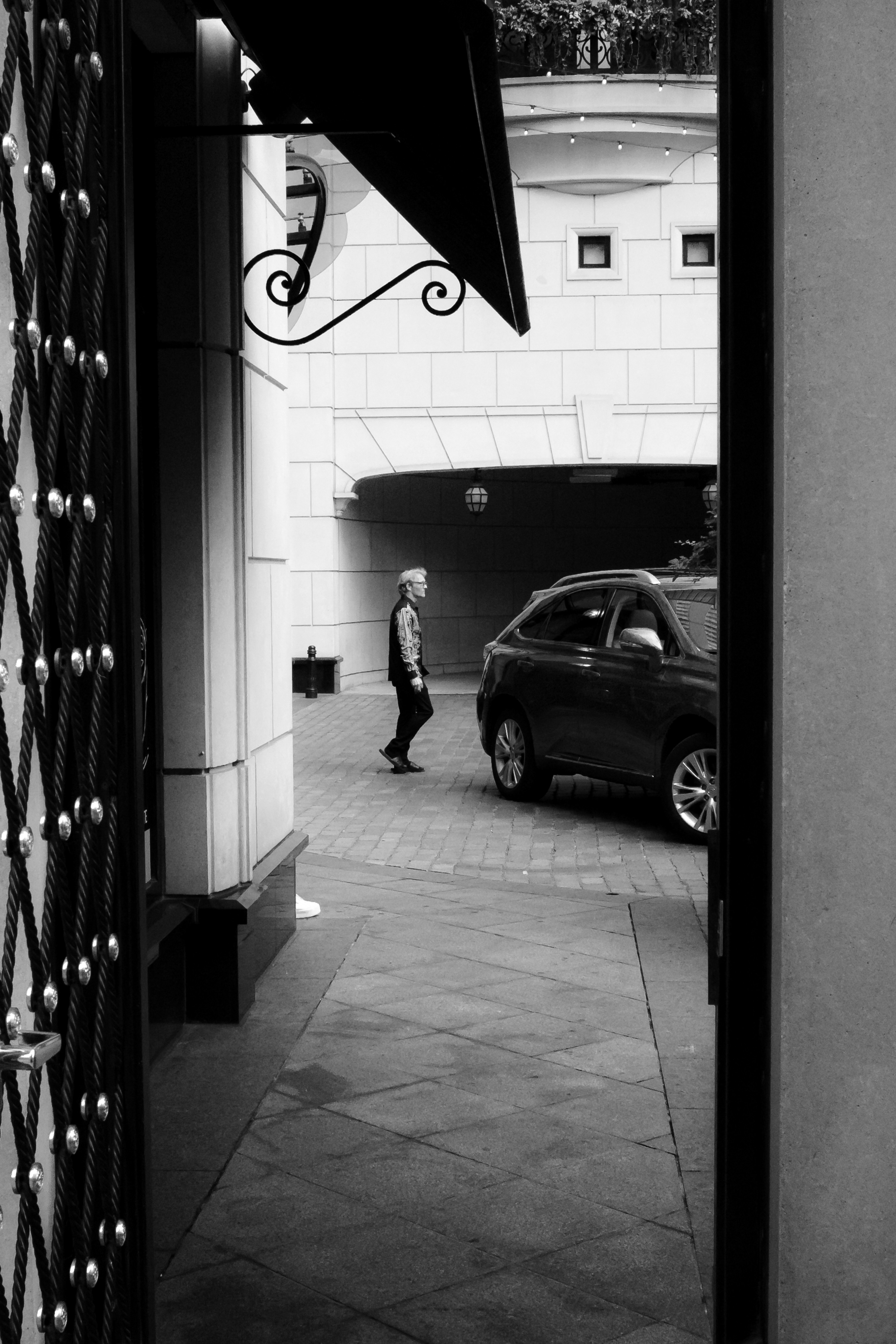 Pathway to the Car Court: A Quiet Moment Under Archways