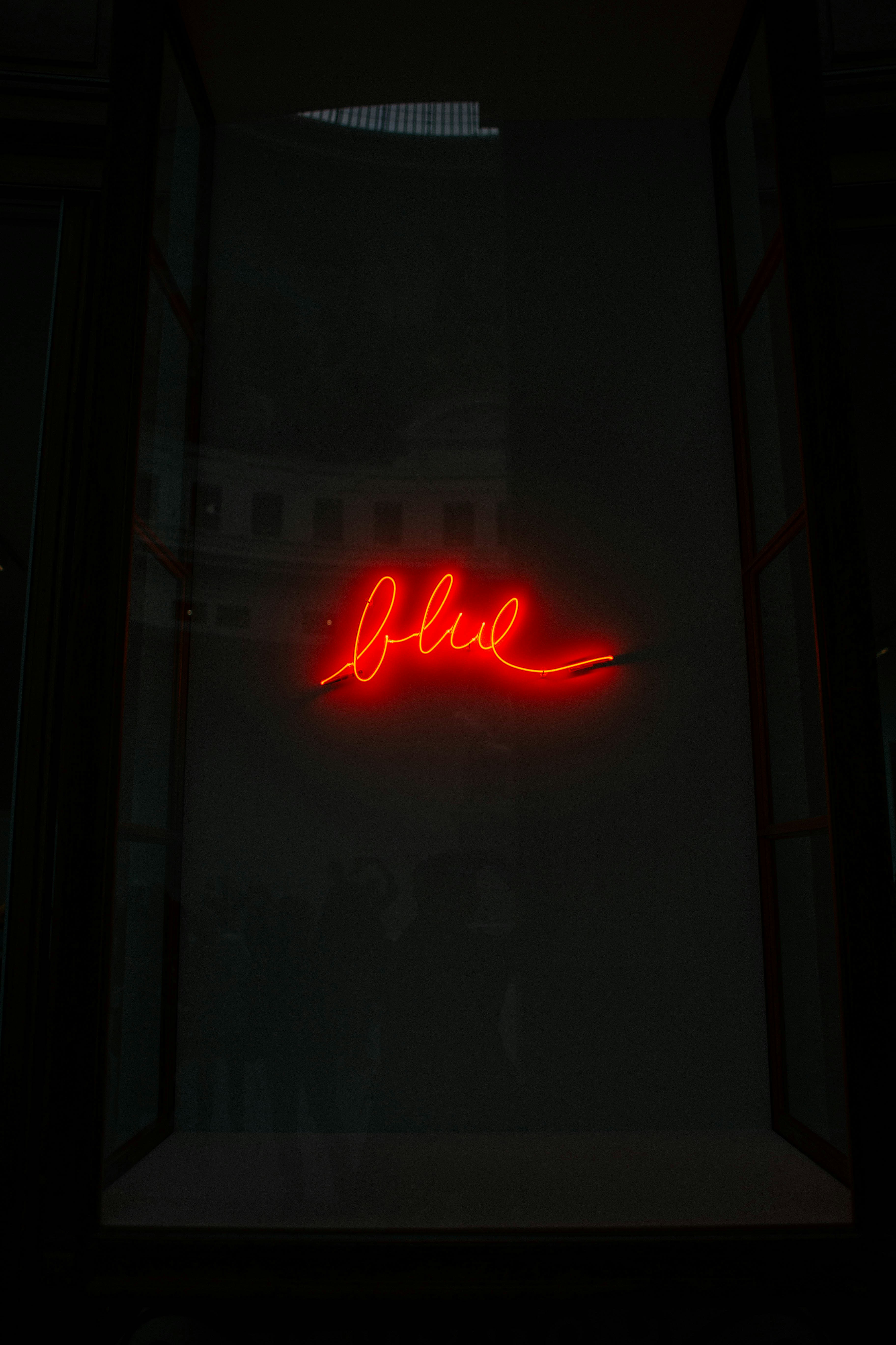 Neon Script in the Dark: A Glowing Red Signature in Silence