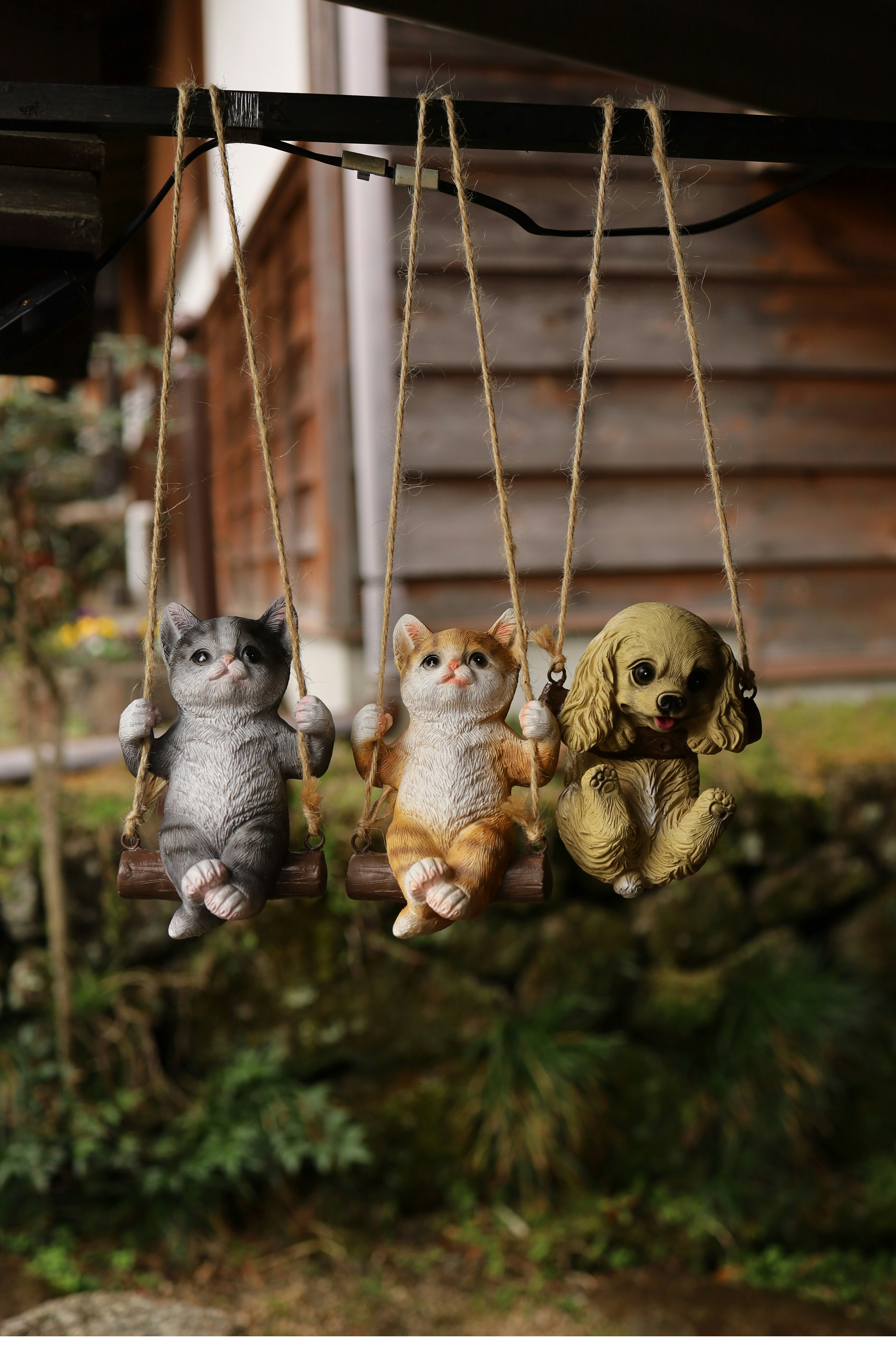 Triple Swing: Ceramics of whimsy under a wooden eave