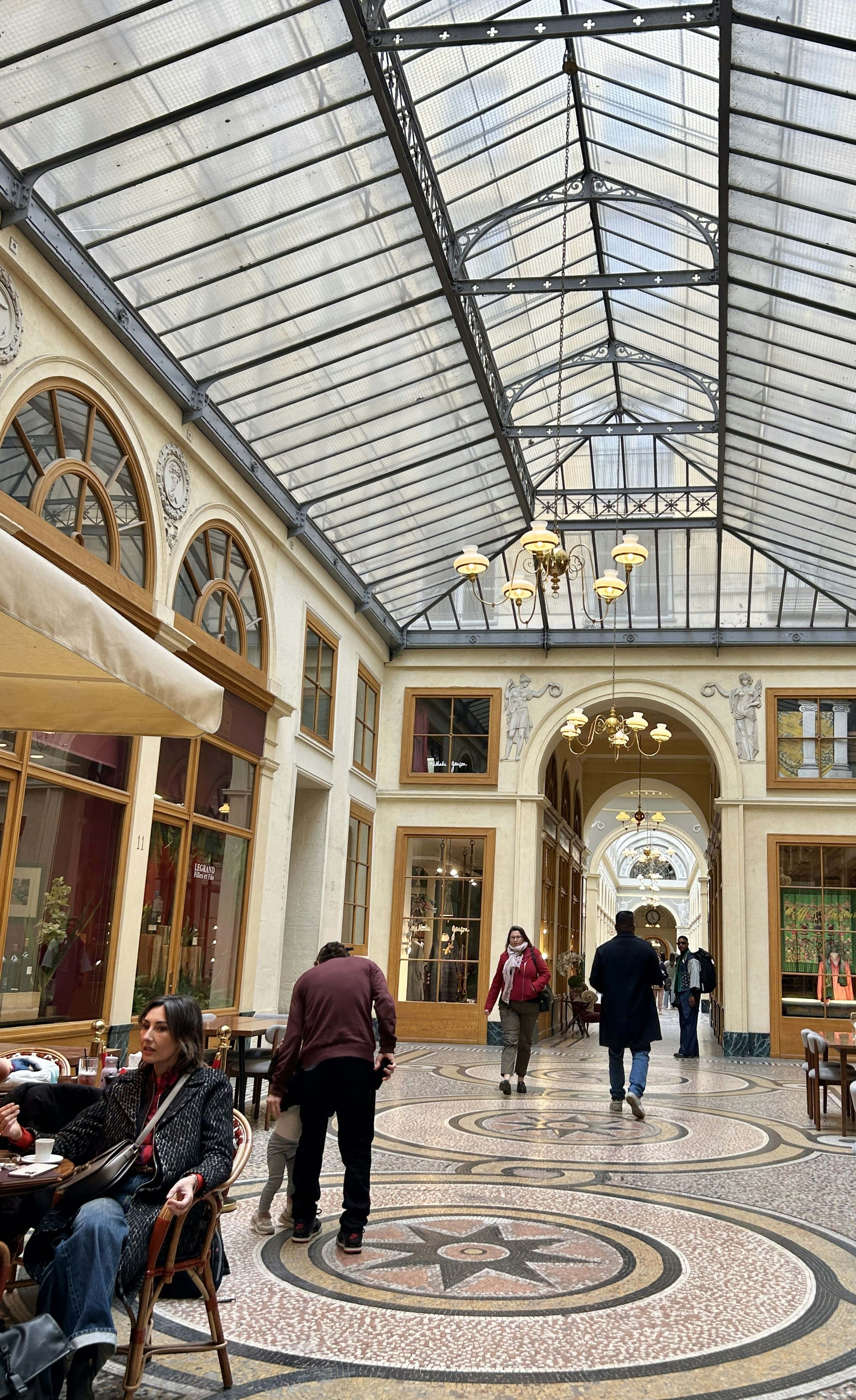 Glass Roof, Marble Floor, and Gentle Arches: A Sunlit Gallery Walk