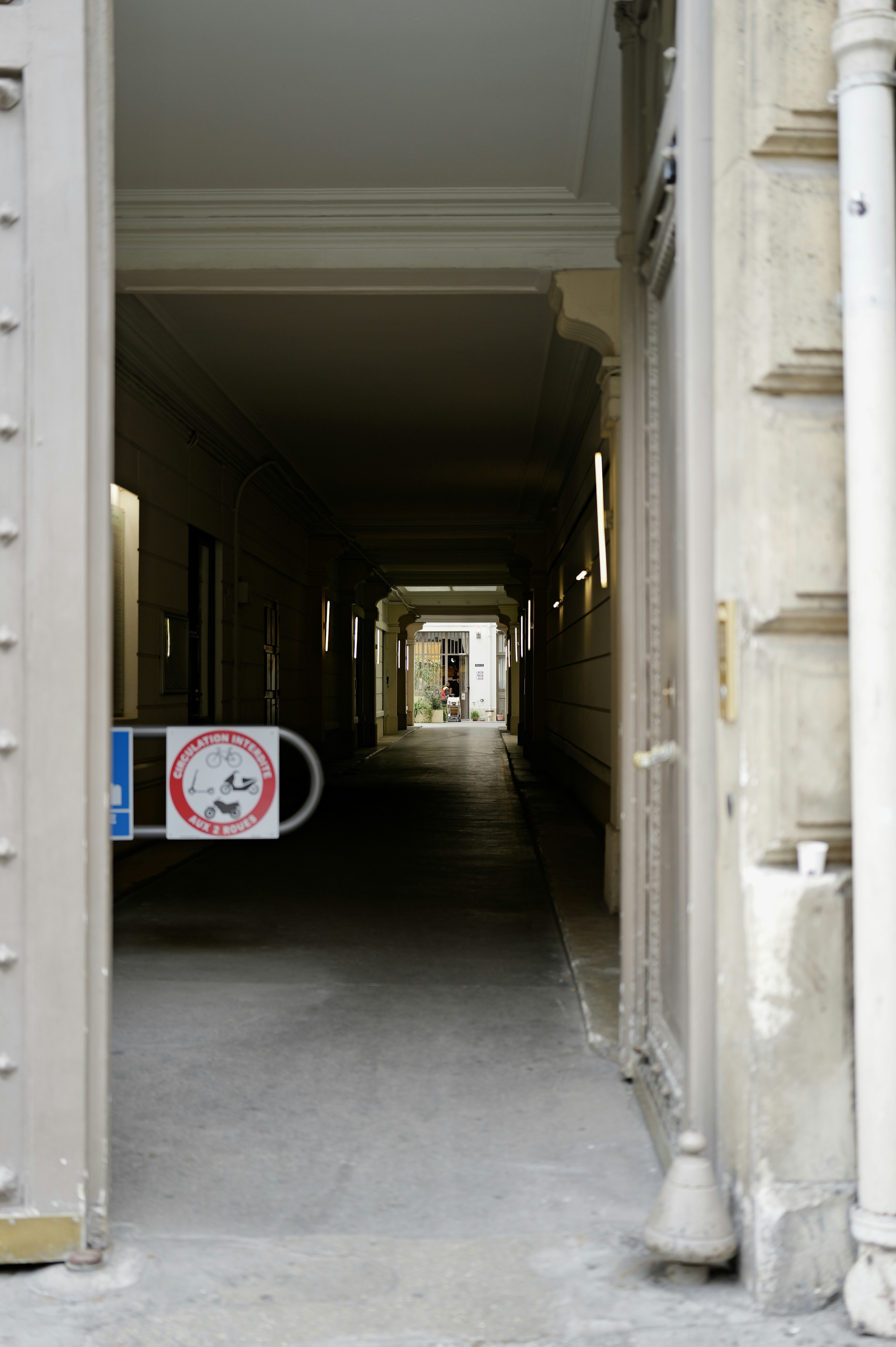 A Narrow Corridor Framed by Old Stone Arches