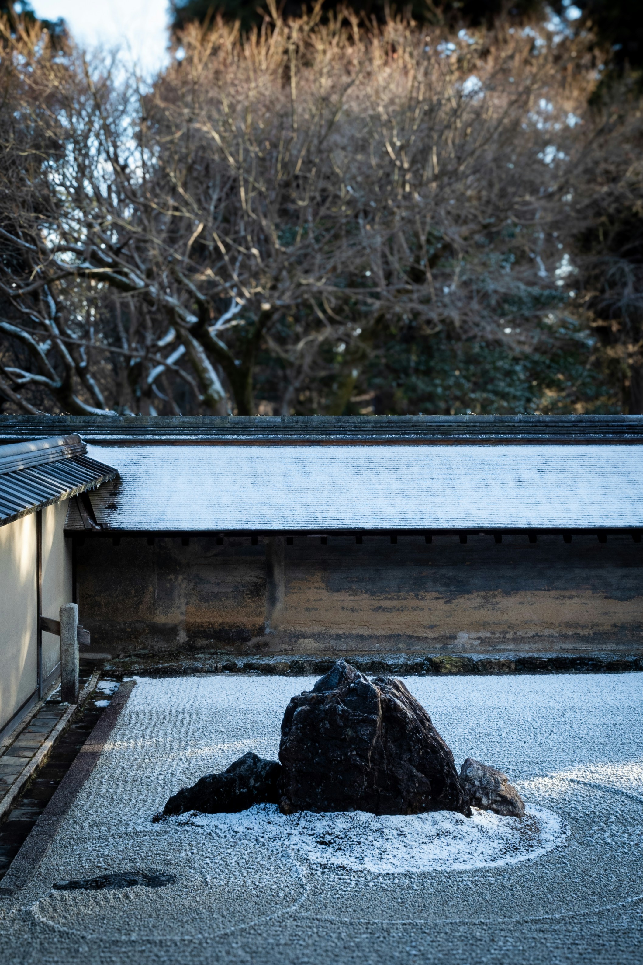 Zen Garden Rock centerpiece under snow-dusted eaves