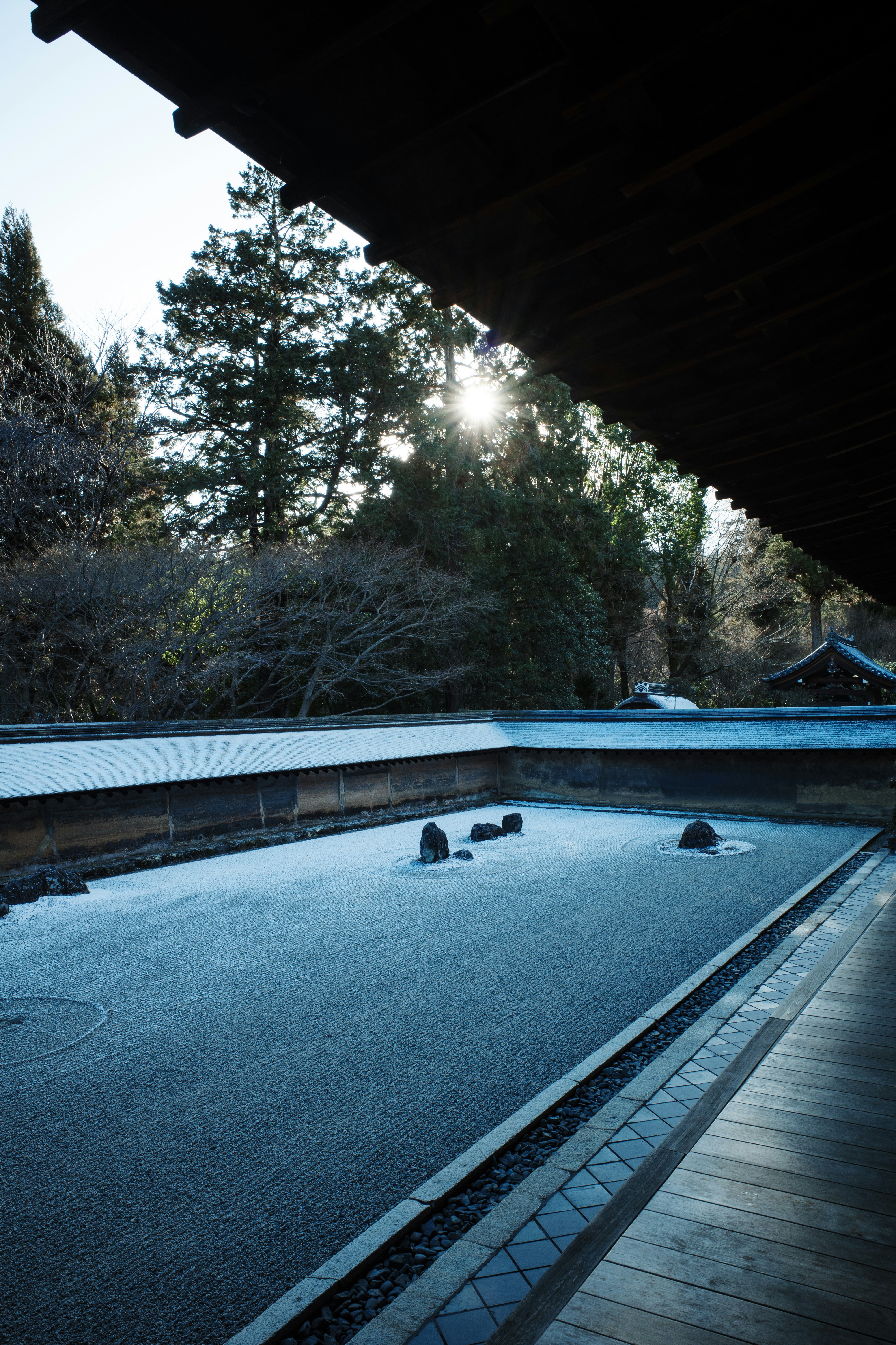 Quiet Courtyard of Stilled Water under a Sunlit Roof