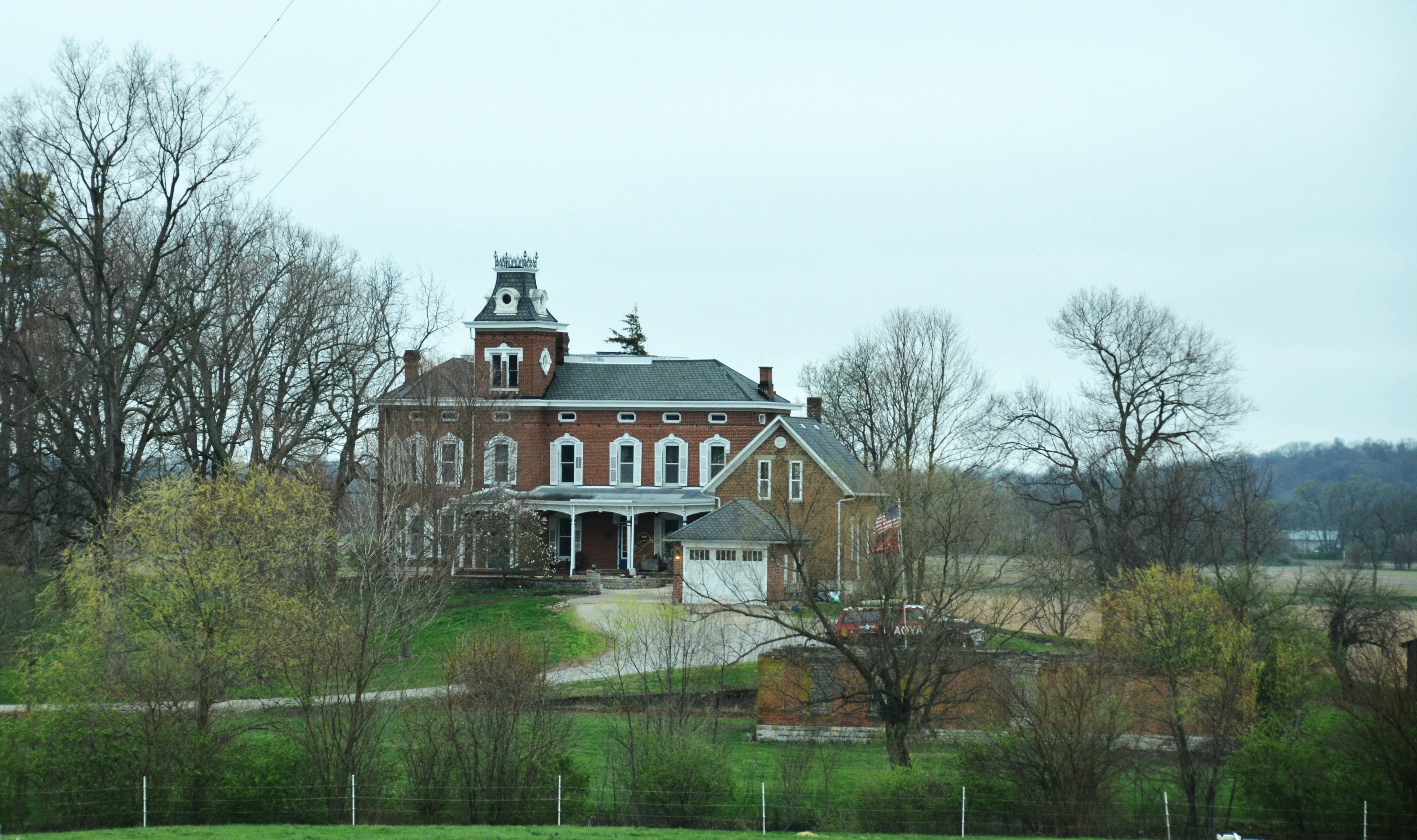 Old Farmhouse Rising from Spring Grass
