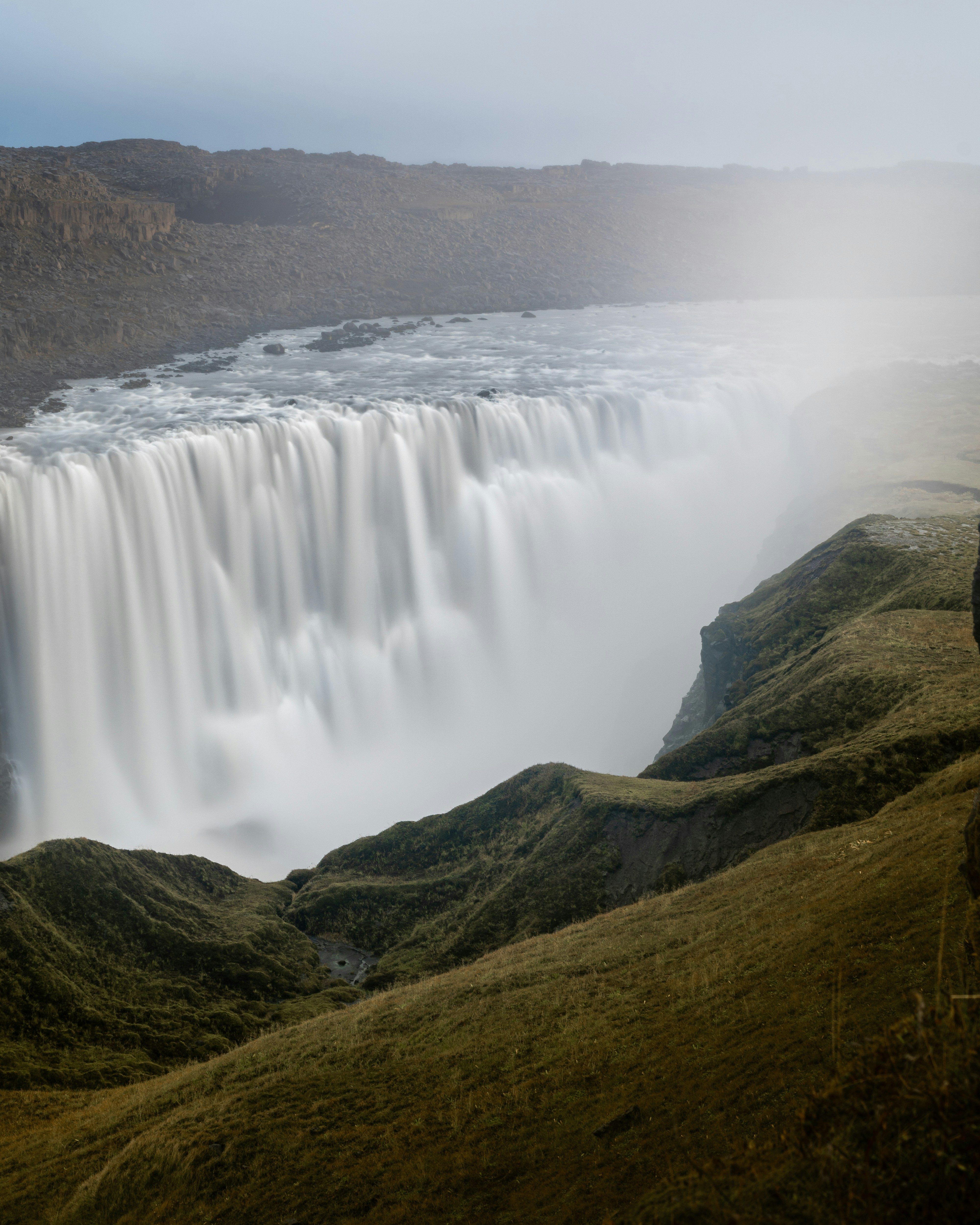 Veil of Mist Over the Edge: A Canyon Falls Panorama