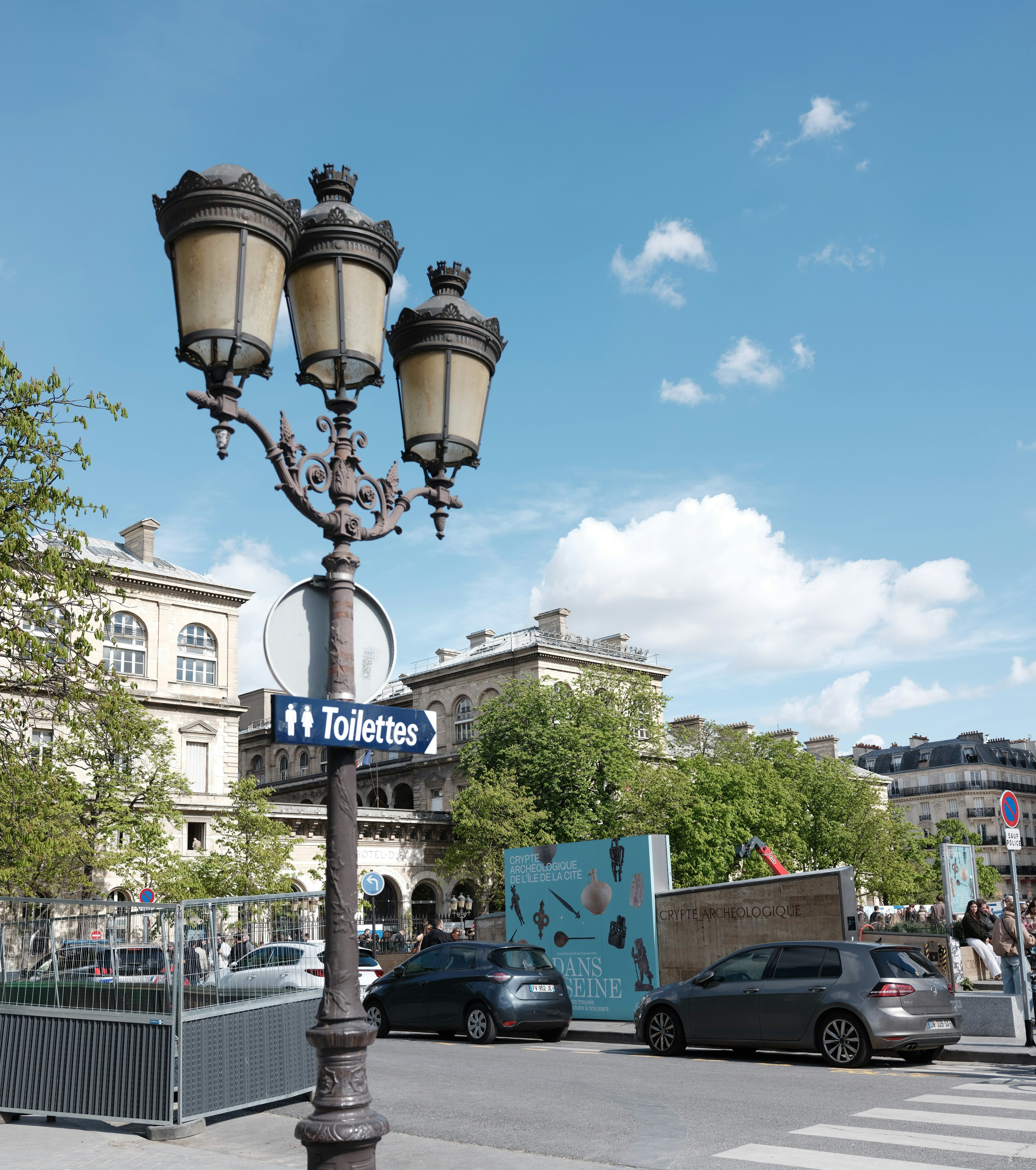 Elaborate streetlamp in a sunlit Parisian square