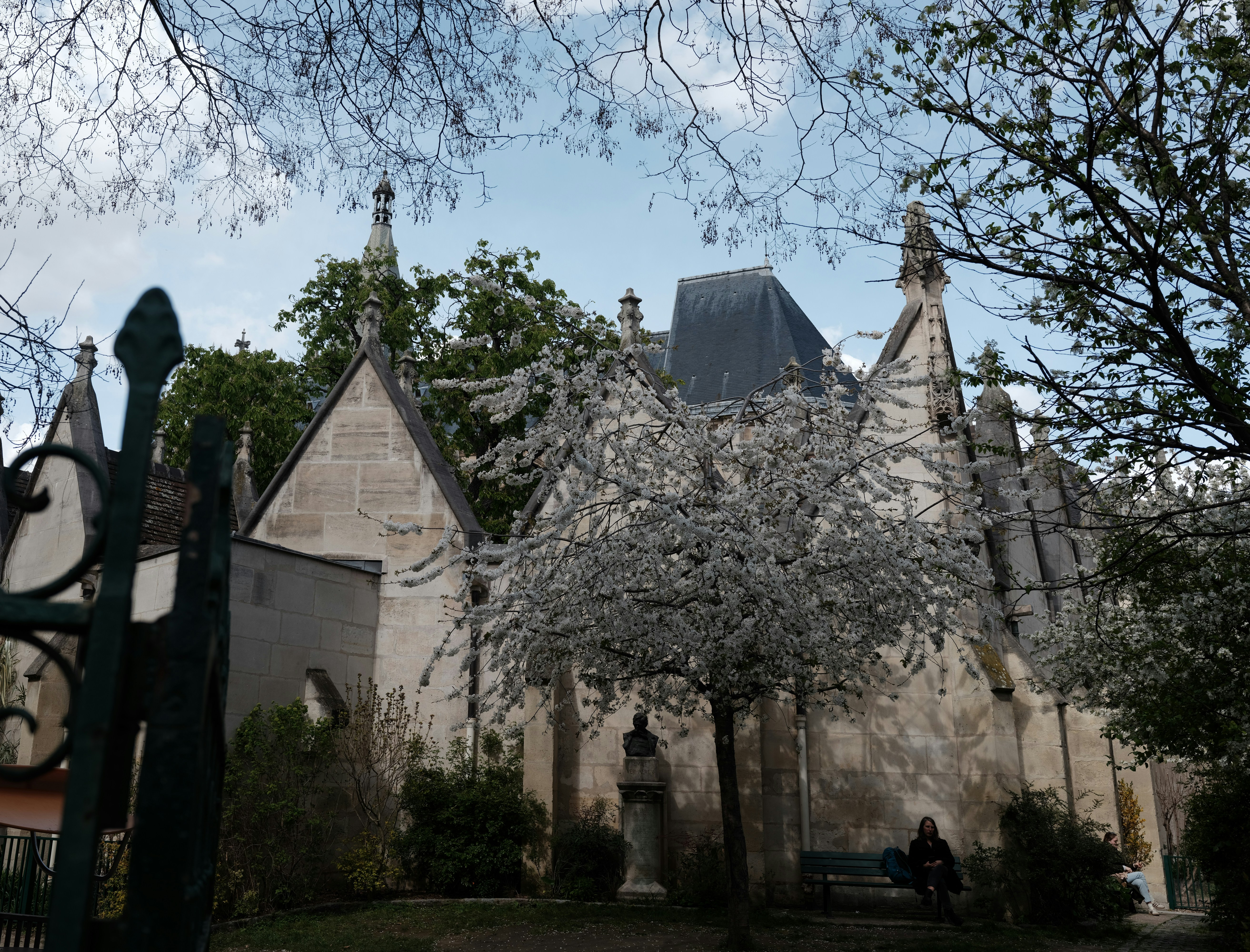 Springtime in Stone: Blossoms Framing an Elegant Chapel