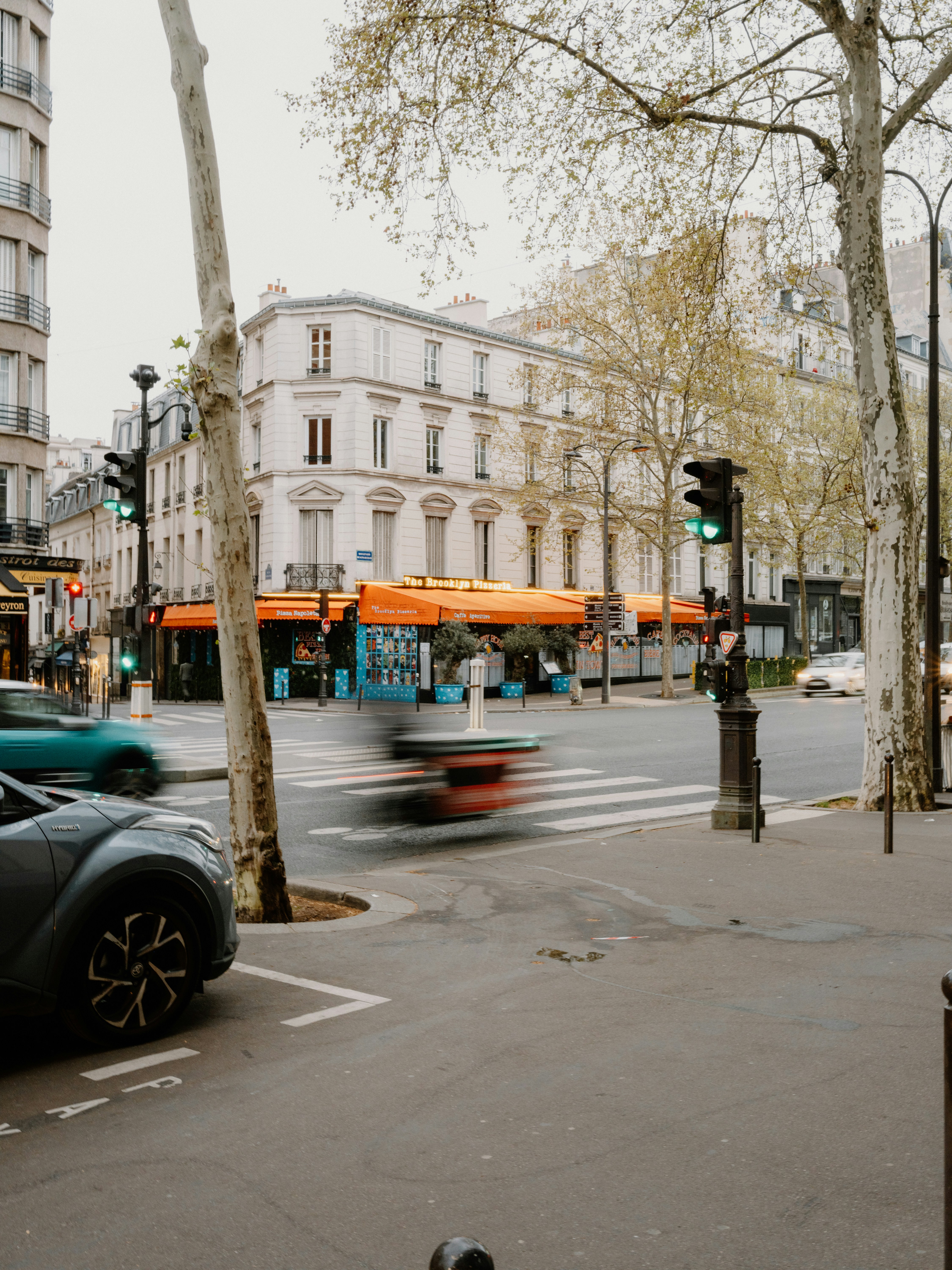 Café Corner on a Parisian Street in Motion