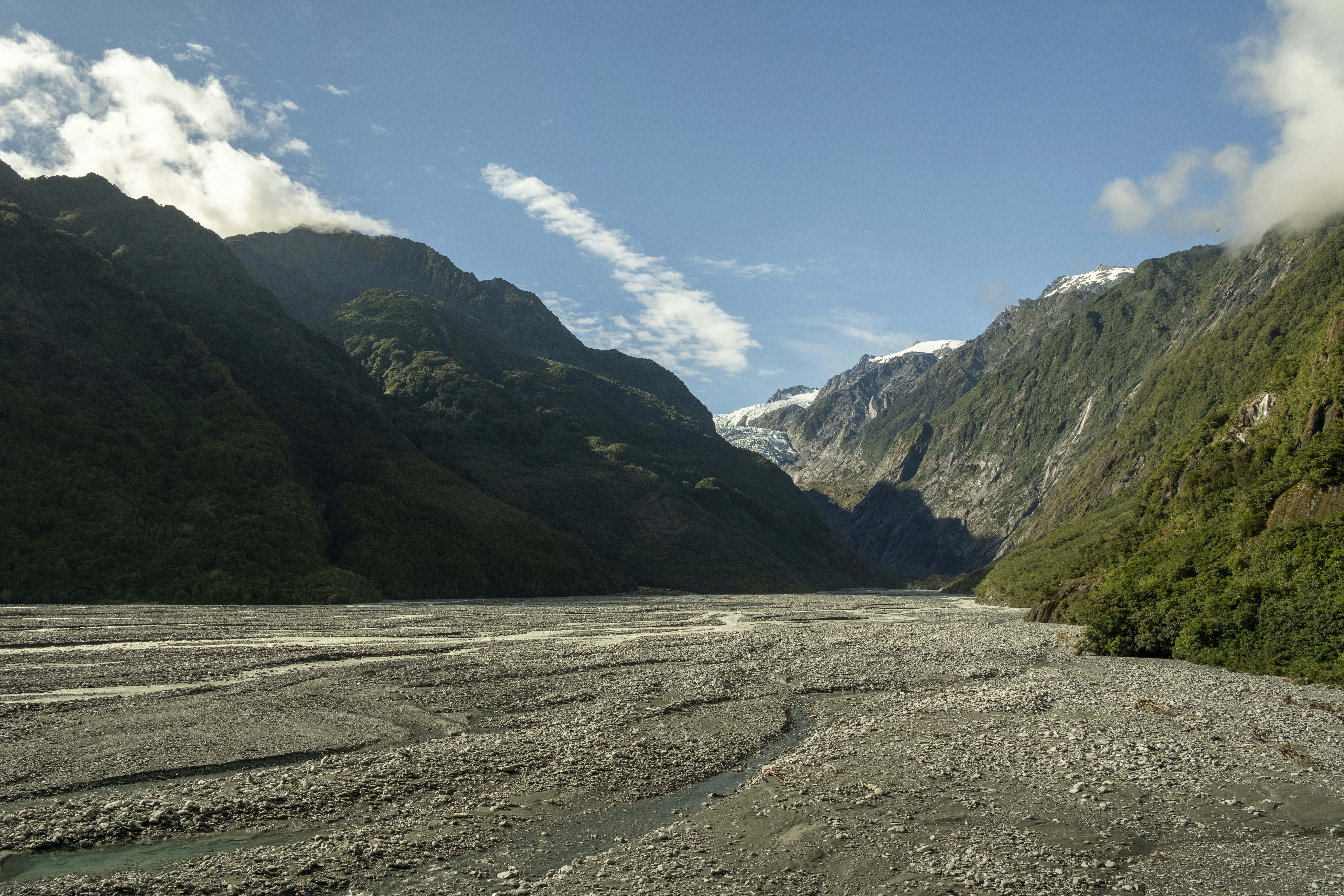 Glacial Valley Converging Toward a Bright Sky