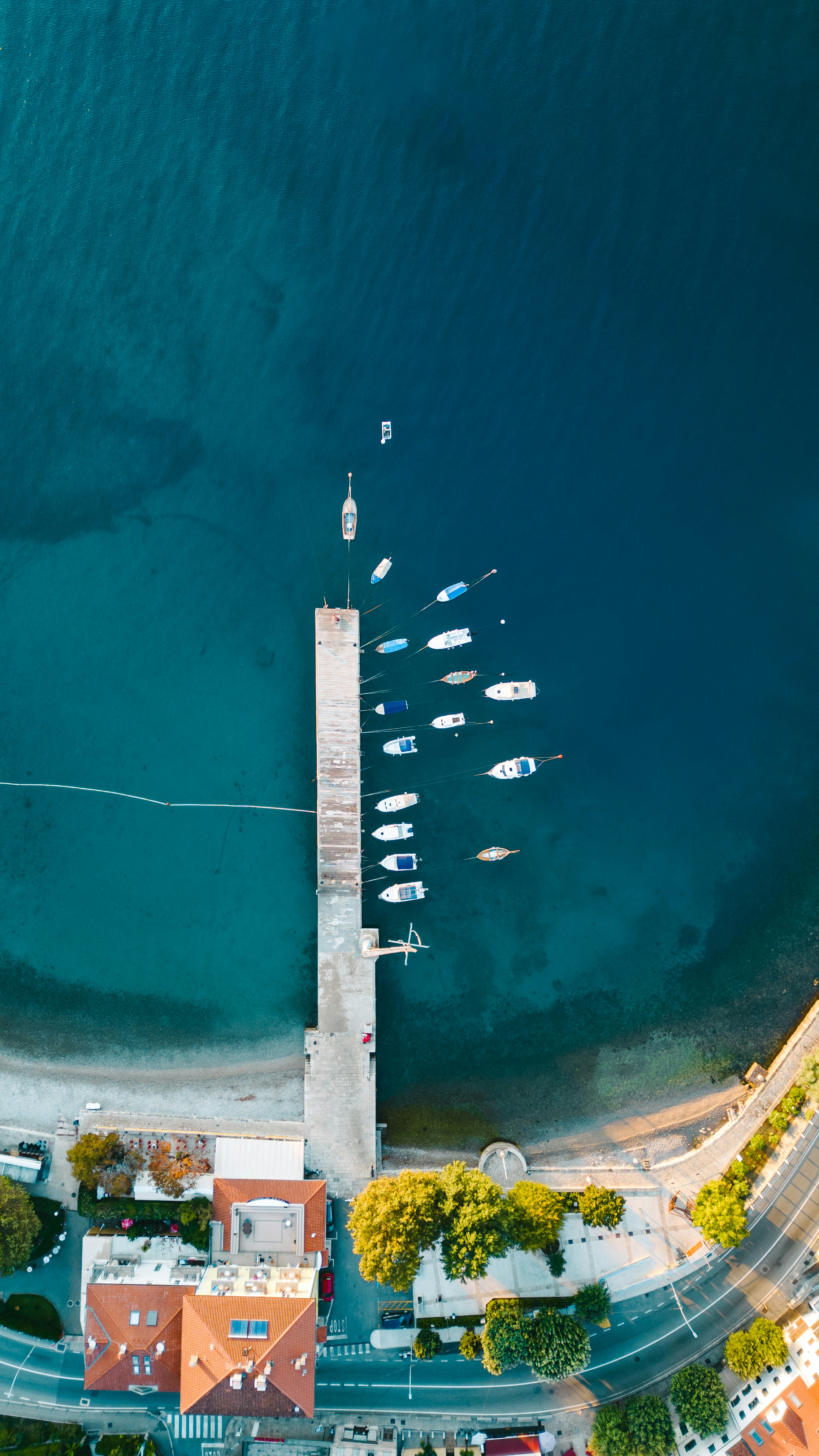 Vertical Marina: Aerial Silence Over a Pier Fitted with Boats