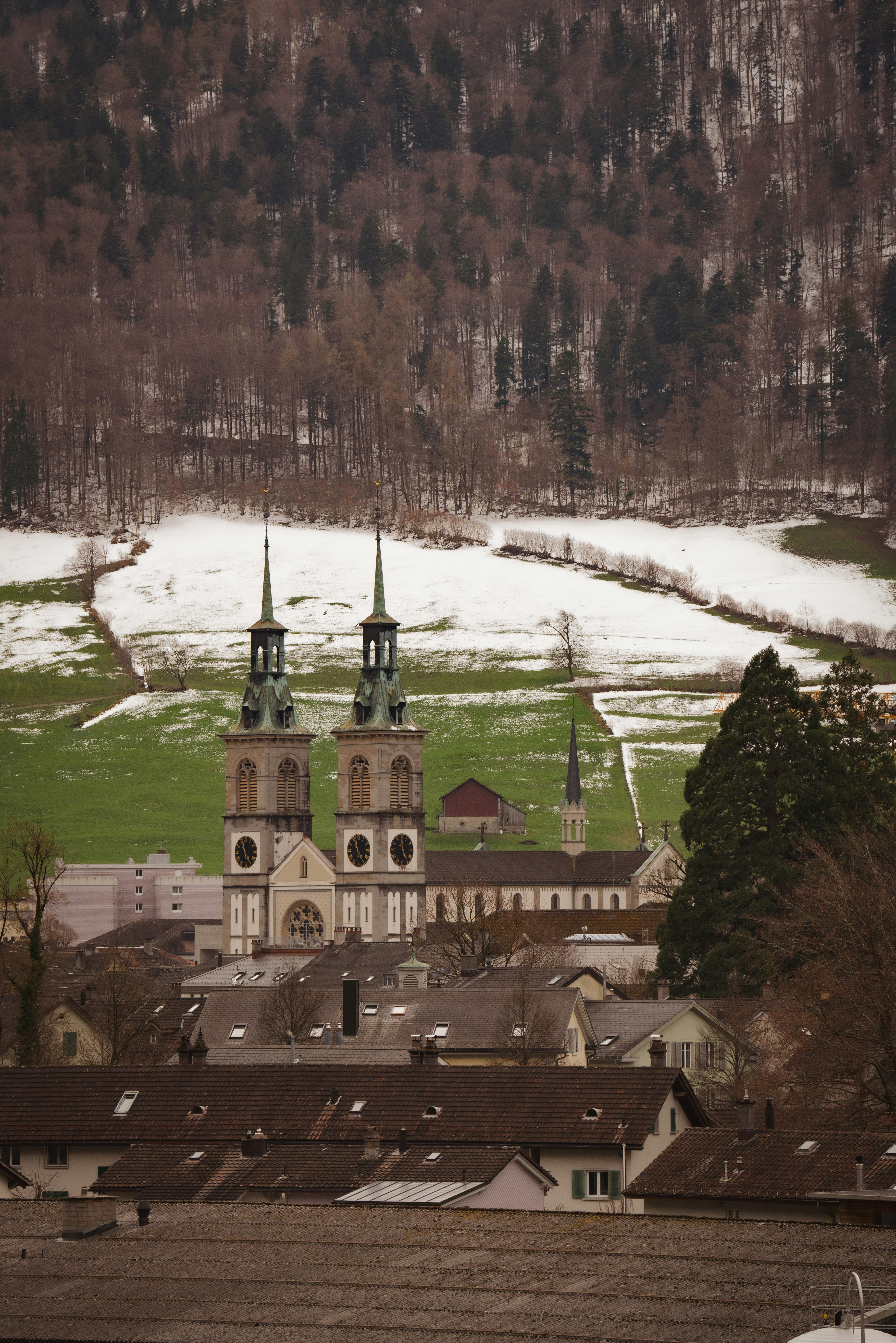 Twin Towers Over a Snow-Striped Valley