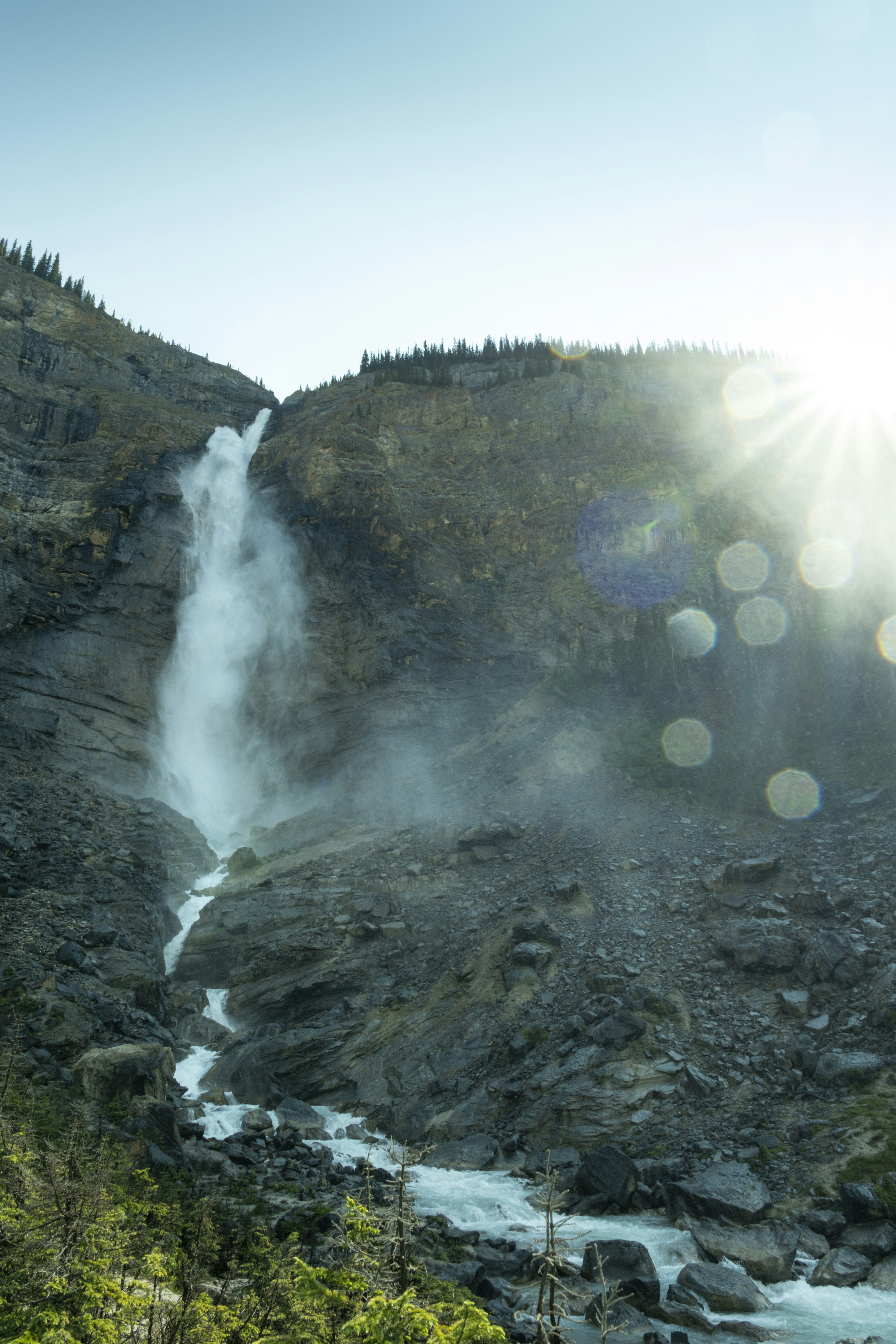 Sunlit Cascade: A Narrow Gorge Surrenders to a Bright Horizon