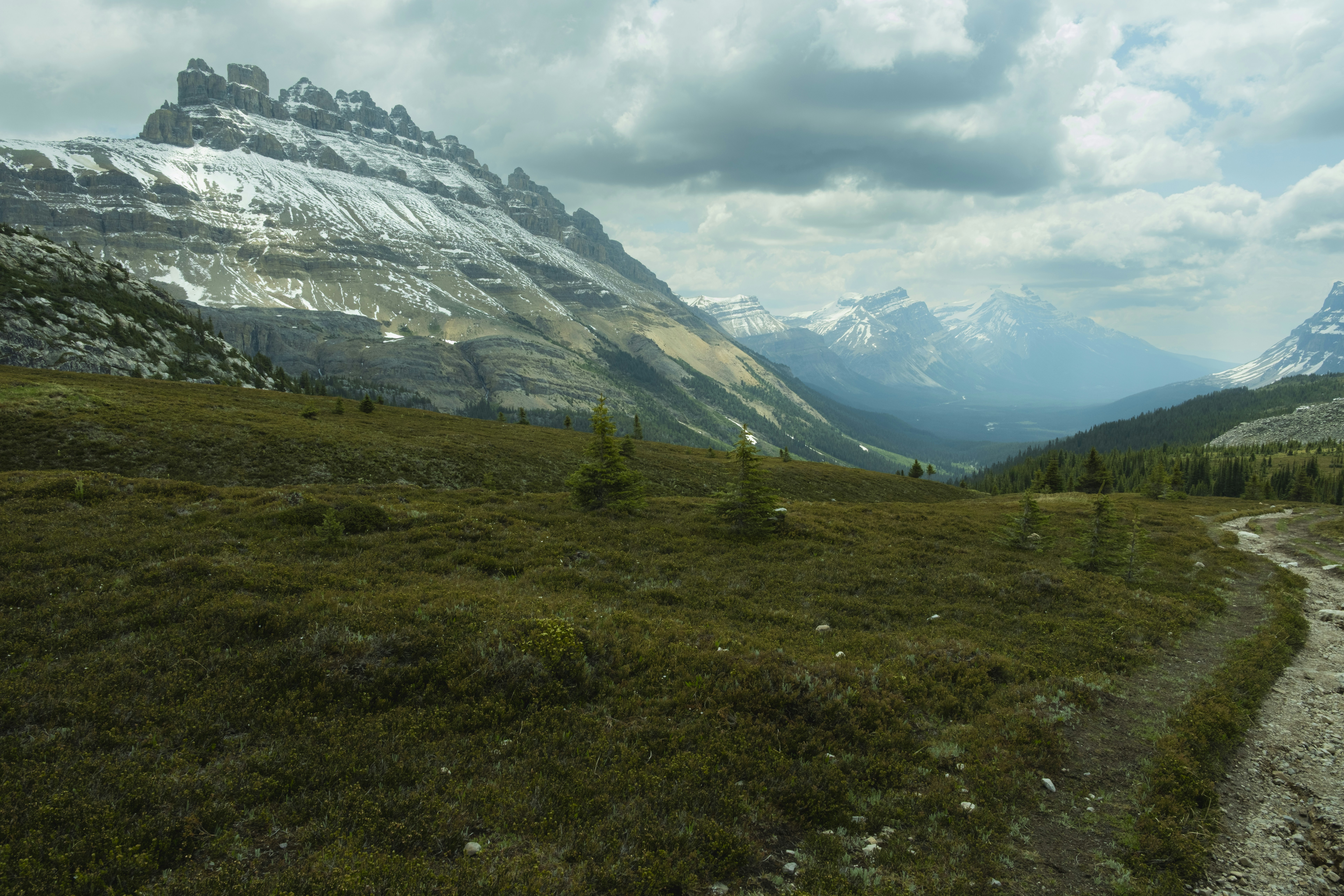 Snow-kissed Peaks Over a Quiet Alpine Plain