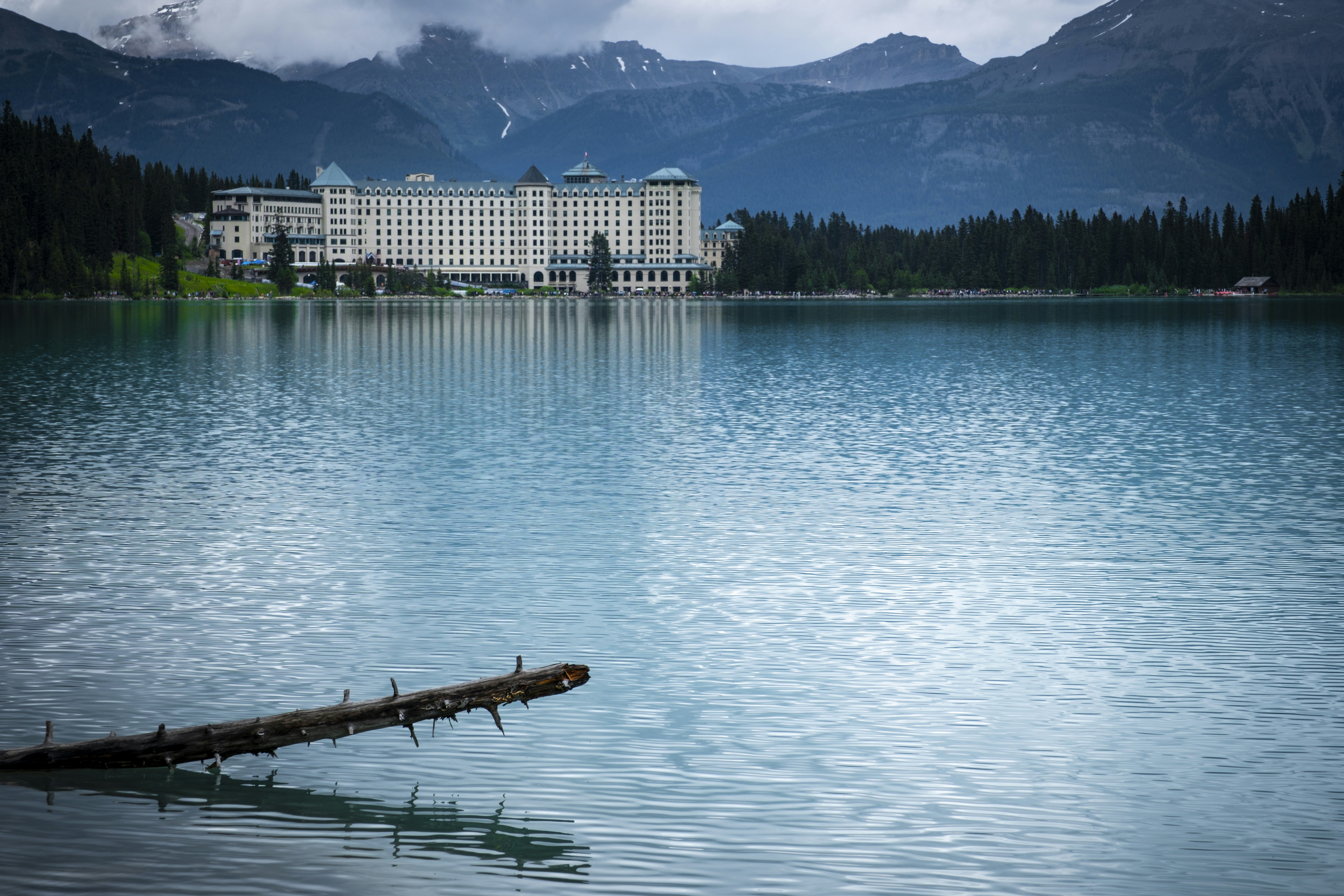 Lakefront Retreat: Alpine hotel on a tranquil glacial blue expanse