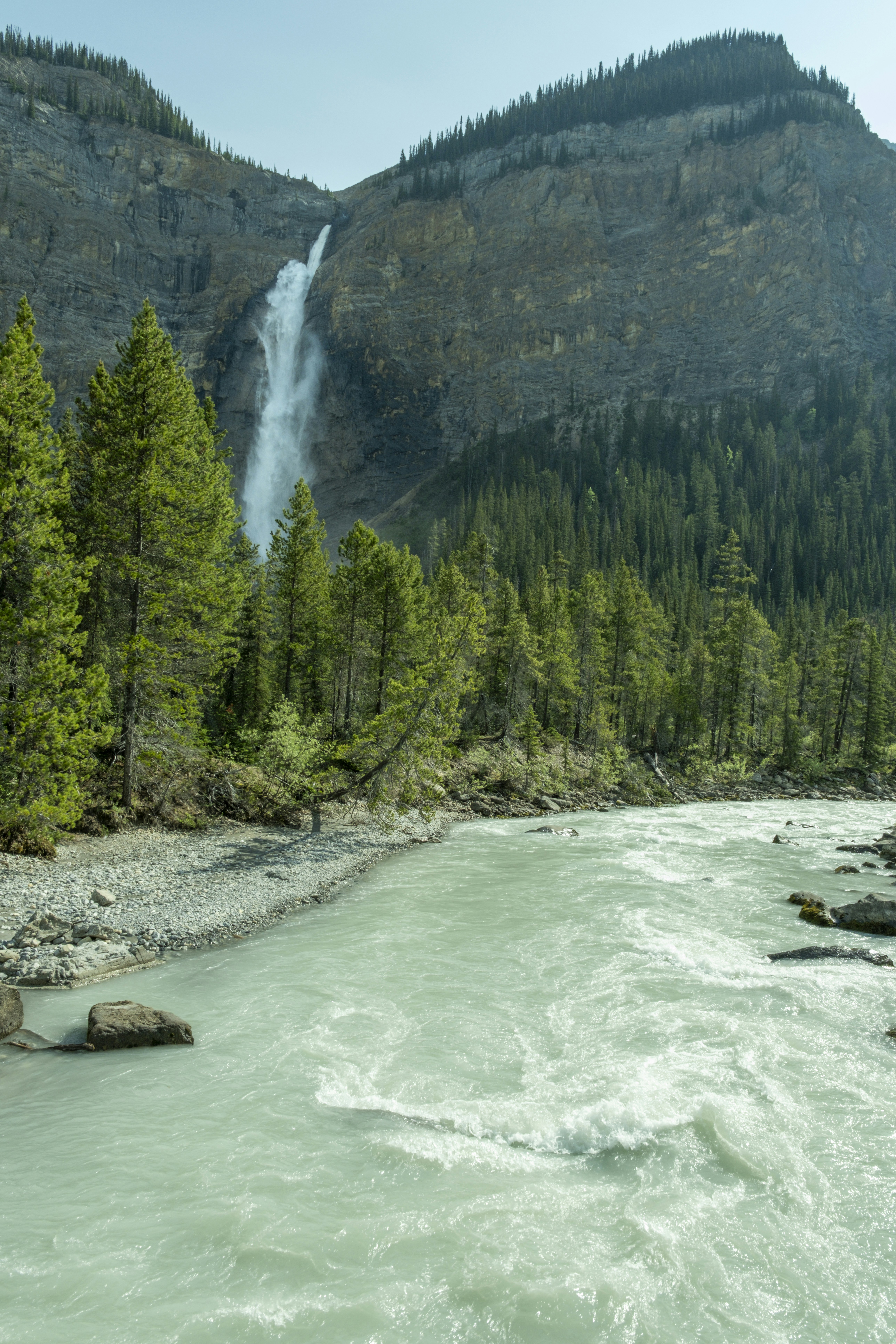 Cascade of Light: River, Trees, and a Hidden Summit