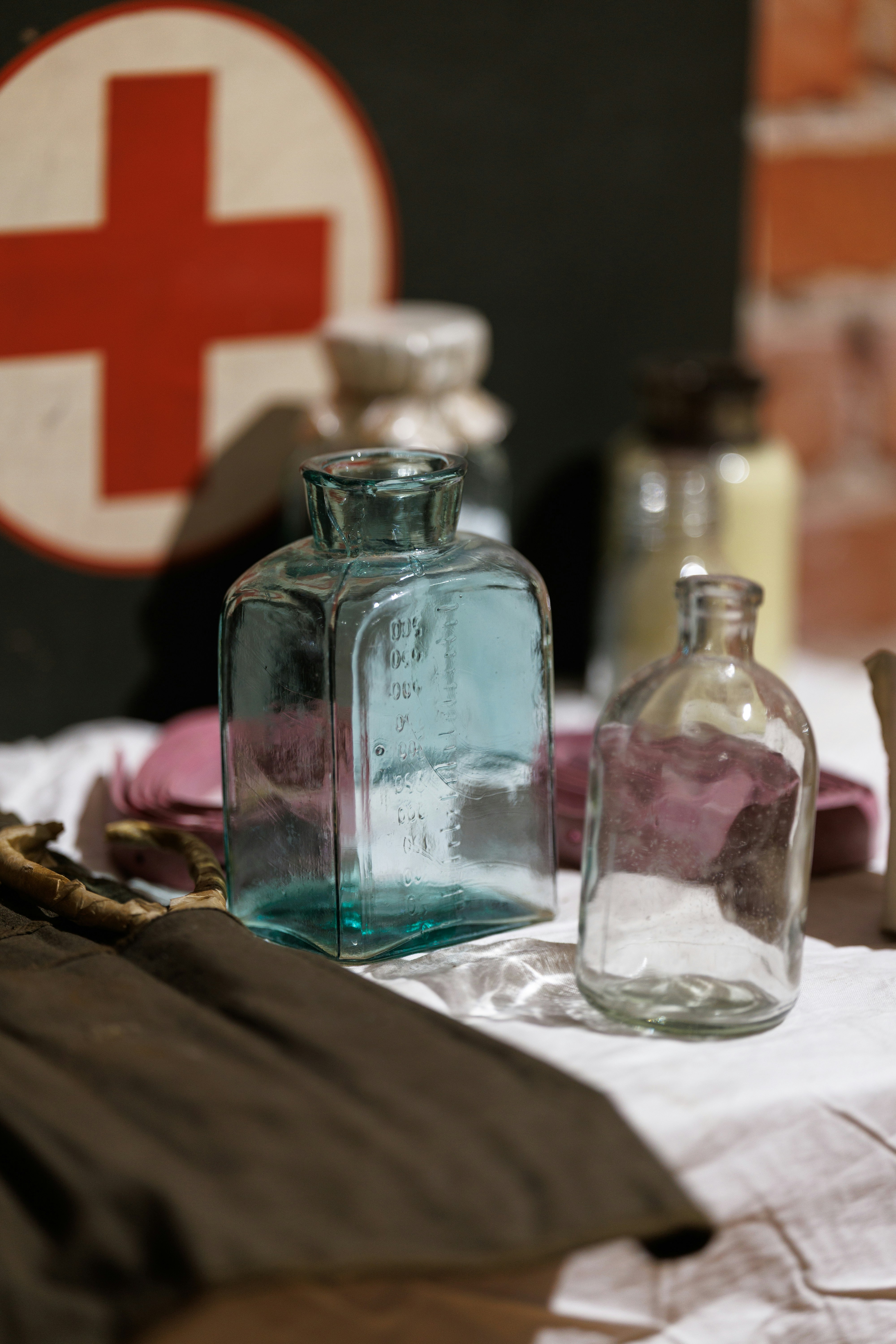 Blue glass bottle centerpiece on a vintage still-life table