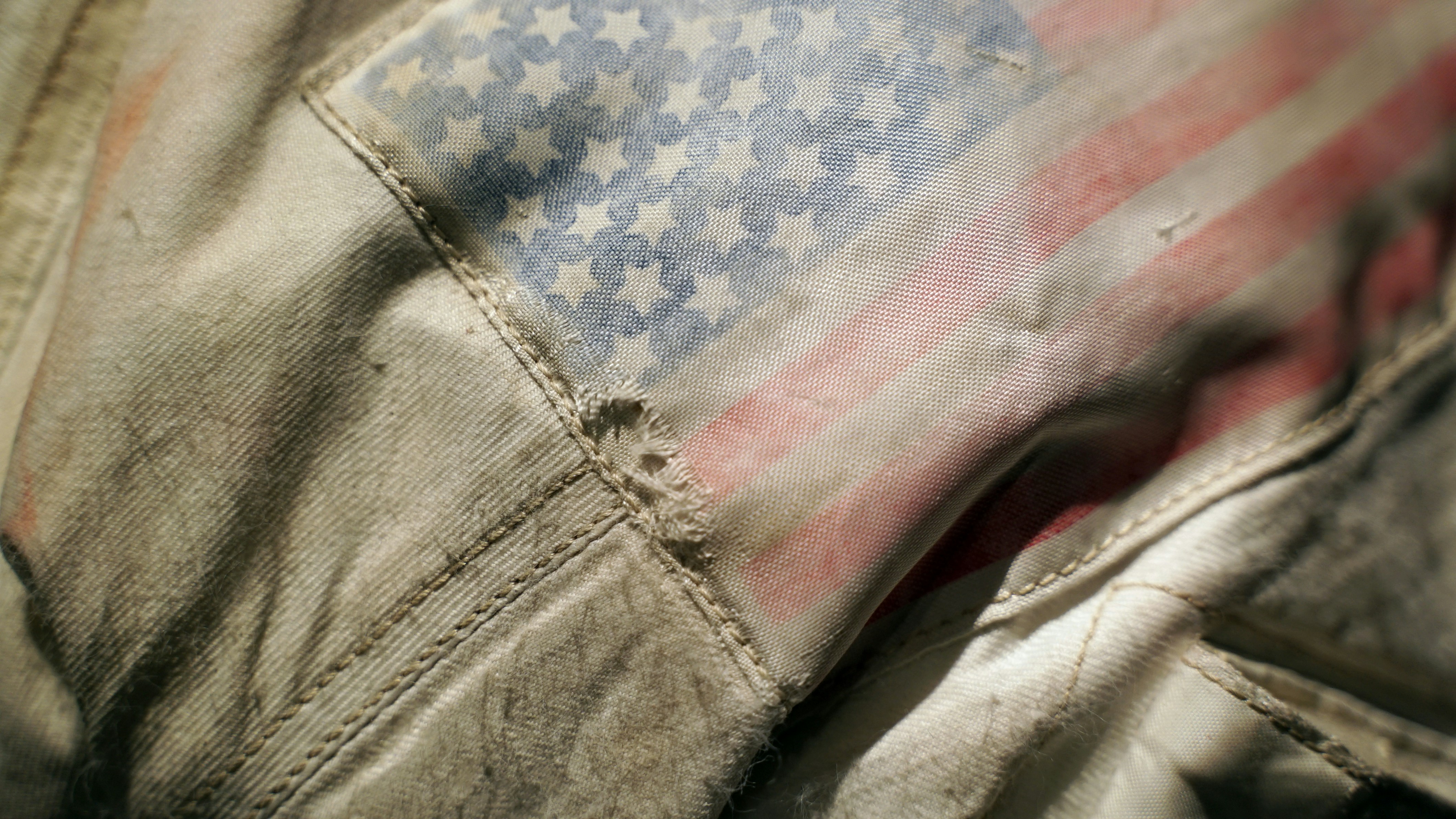 Weathered Americana: A Flagged Denim Patch and Sturdy Stitchwork
