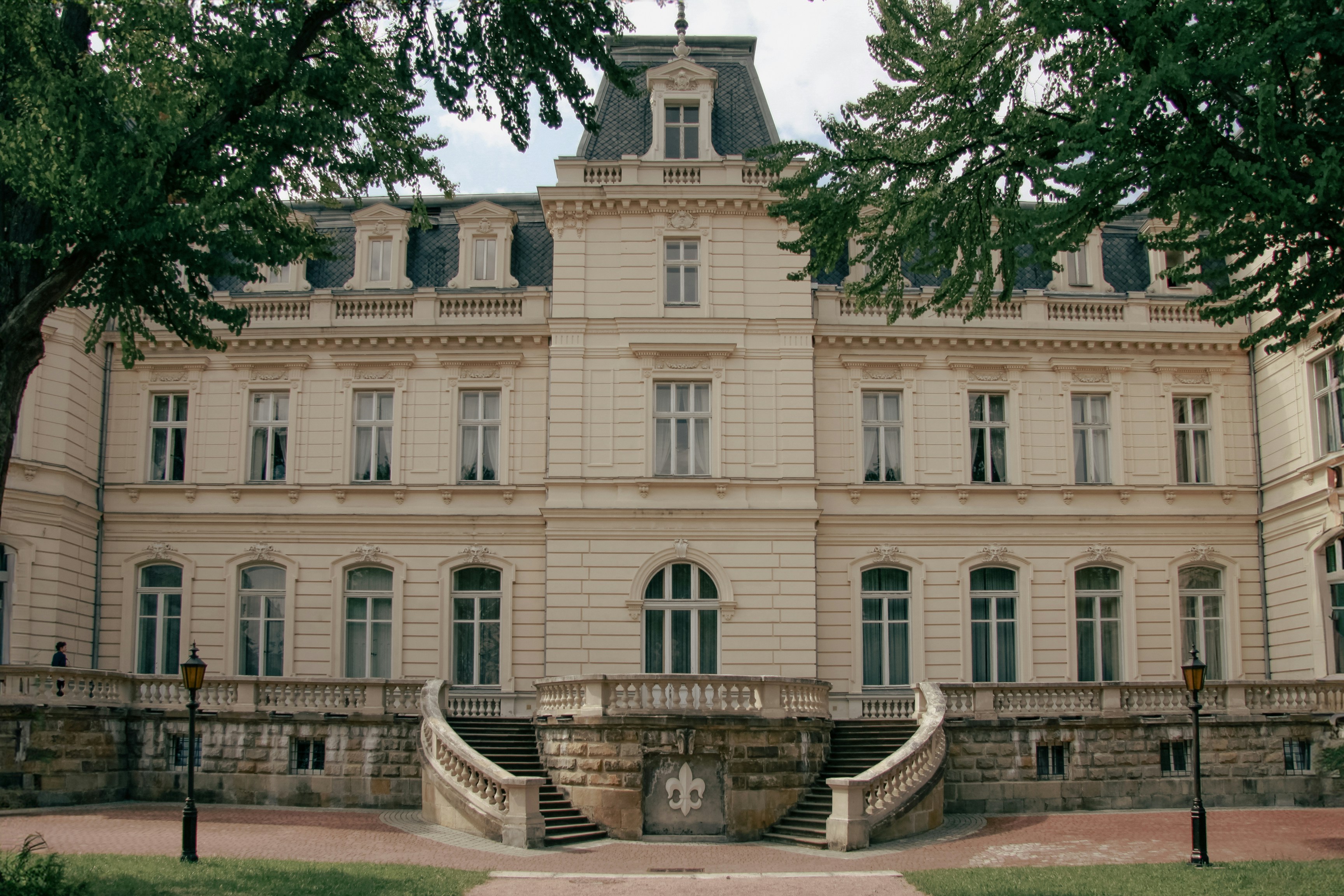 Elegant Estate Doors: Symmetry at the Grand Stairs
