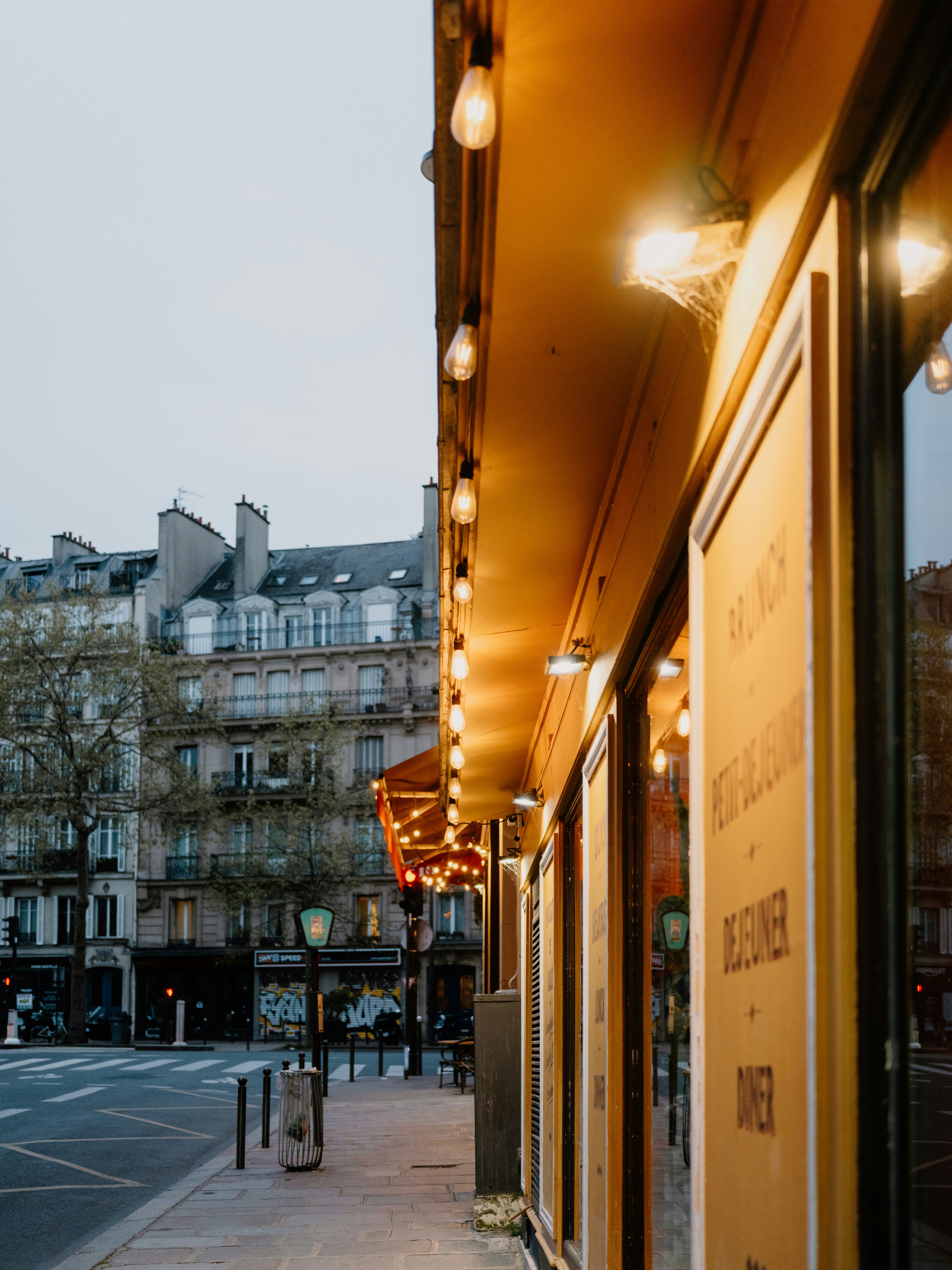Neon Glow Along a Parisian Arcade