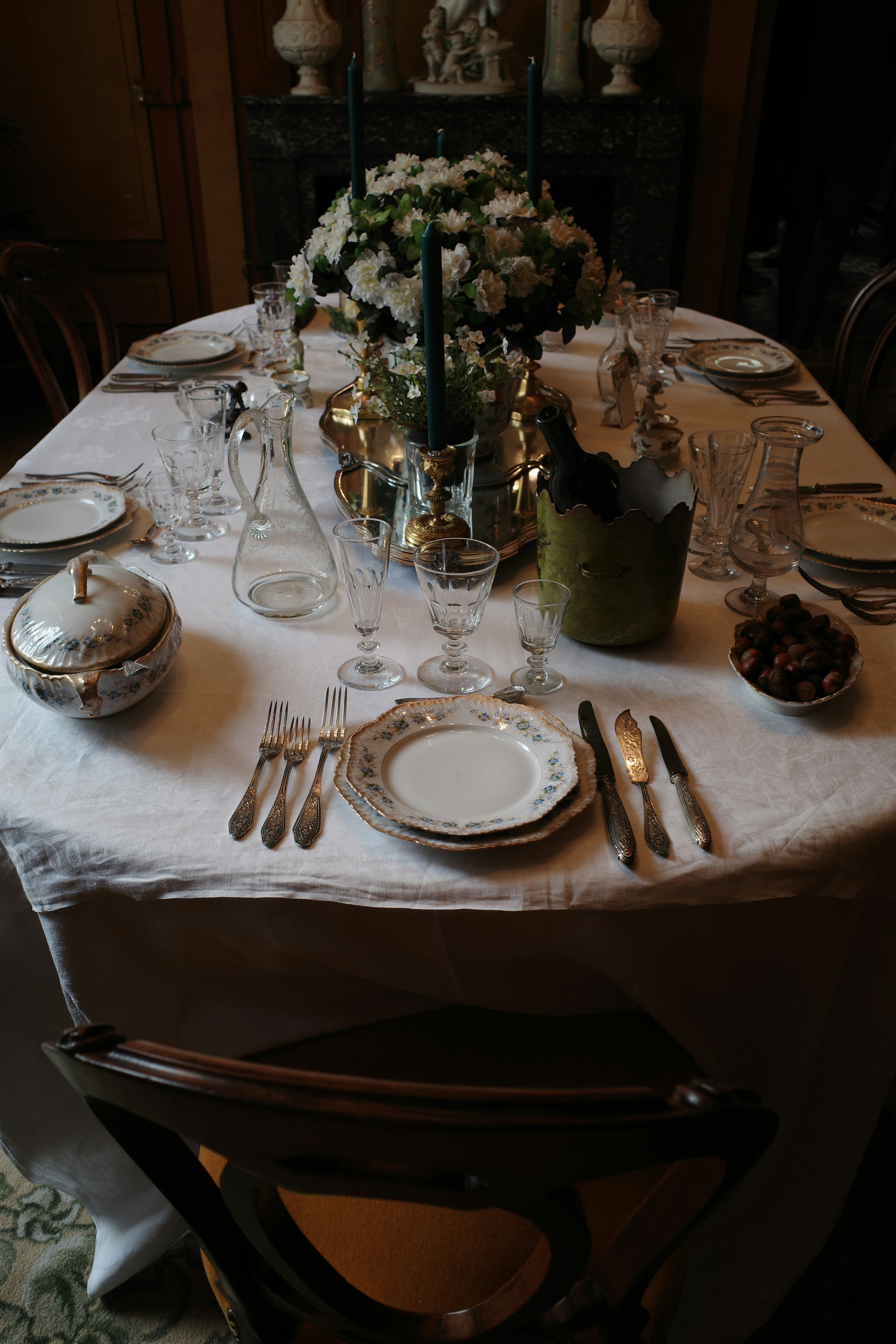 Elegant banquet tableau with floral centerpiece and pale china