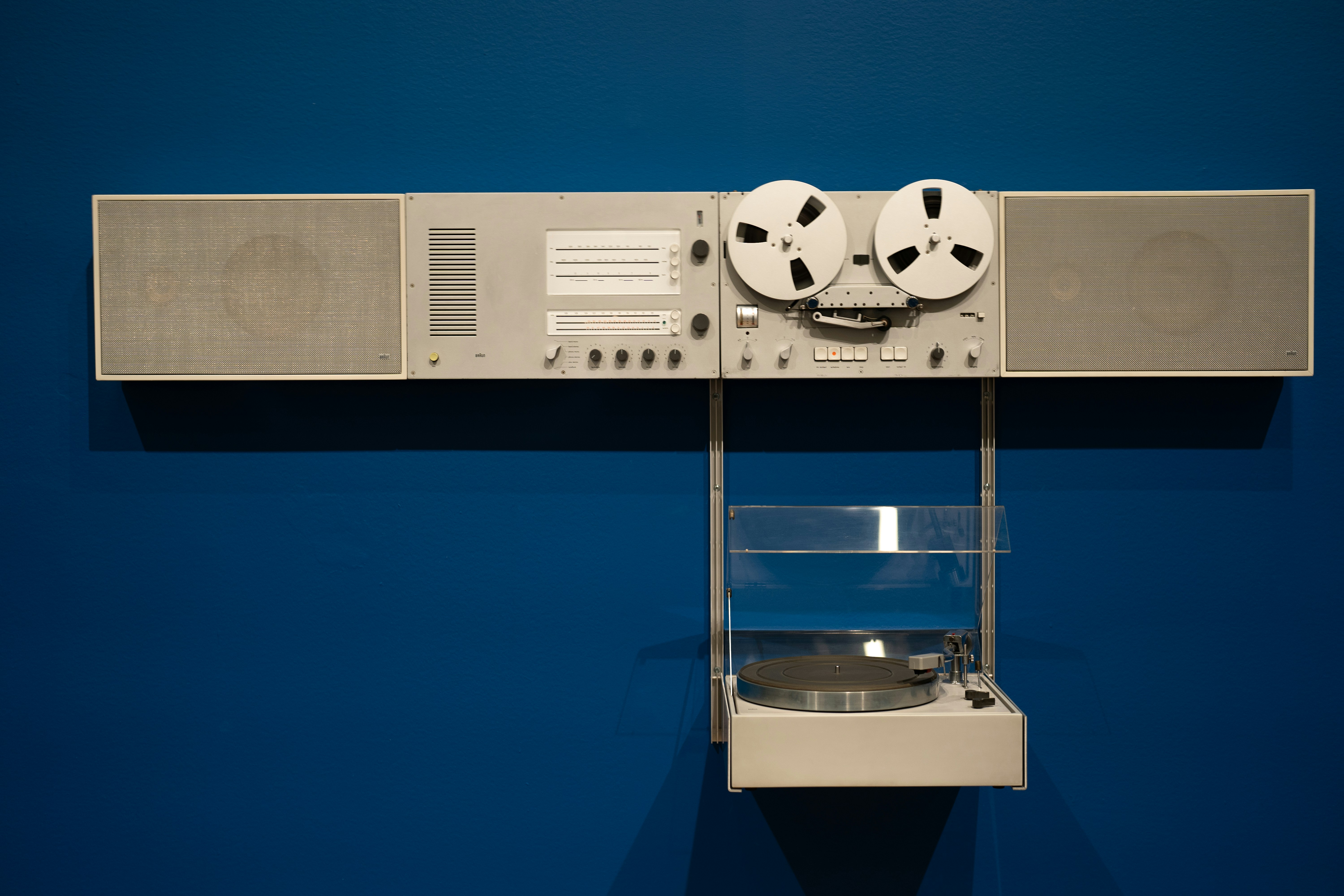 Retro Reel: A Blue Wall Hosts a Vintage Tape Deck Ecosystem
