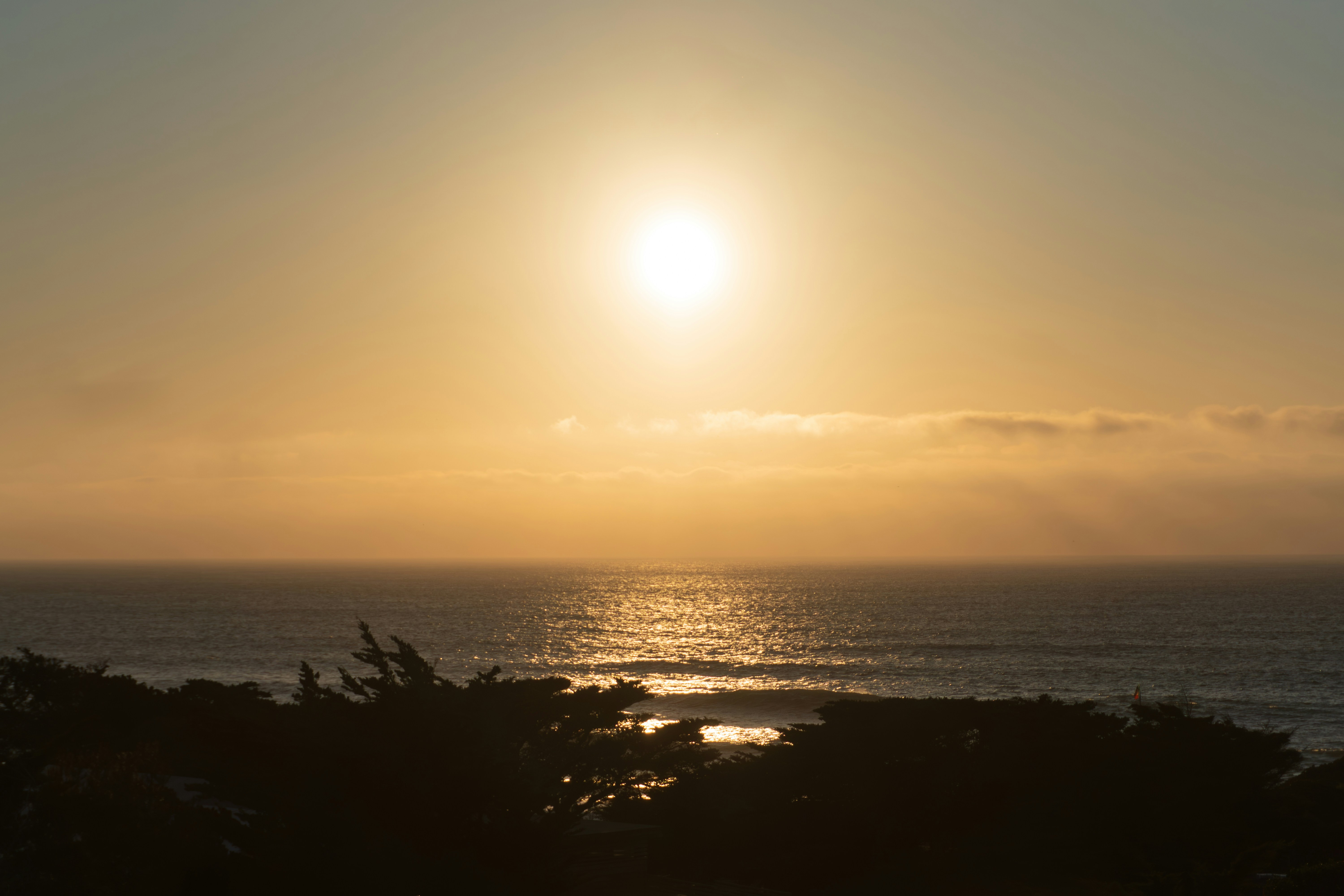 Solar Halo Over Quiet Sea at Dusk