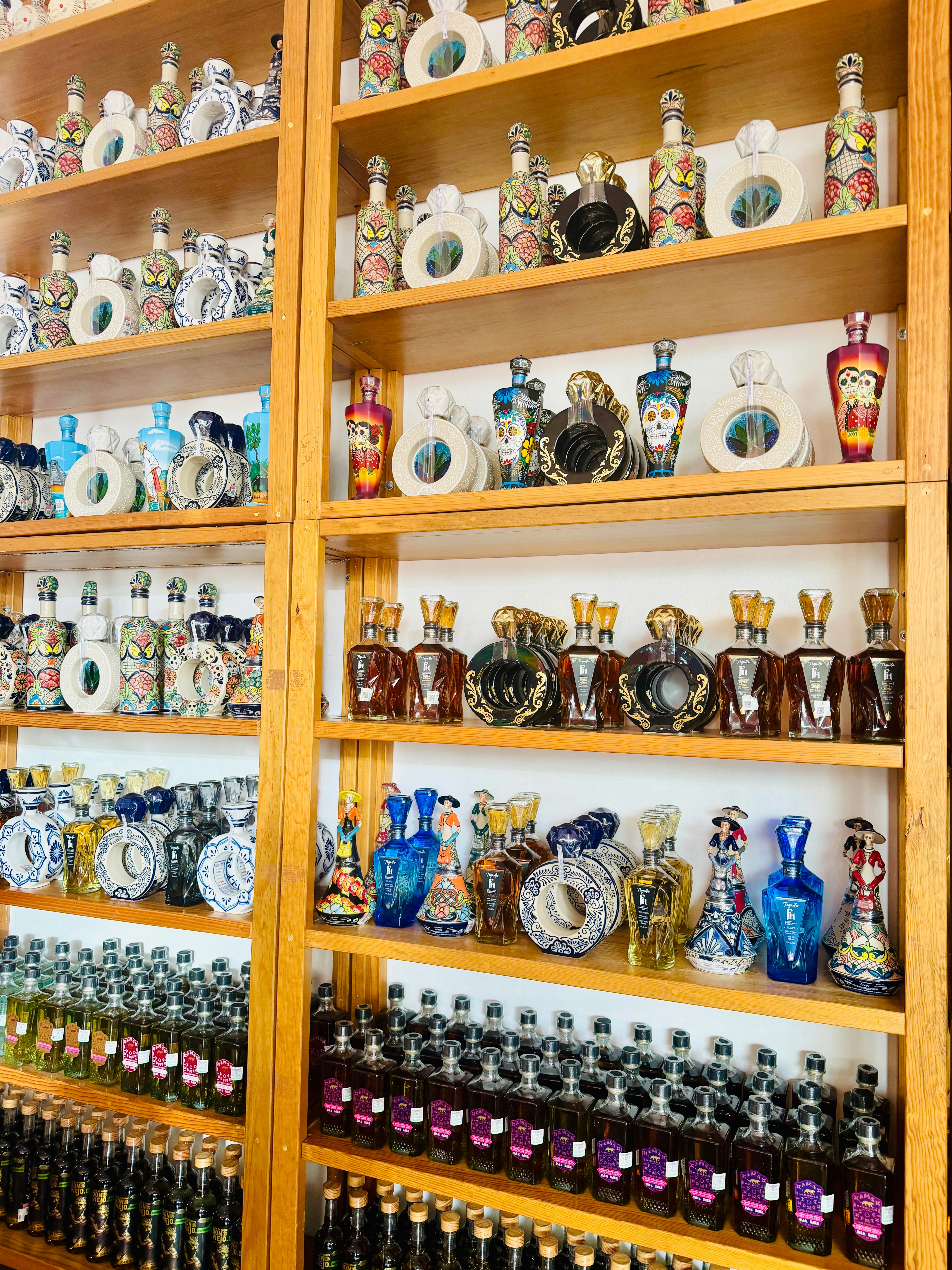 Colorful Ceramic Bottles on Wooden Shelves
