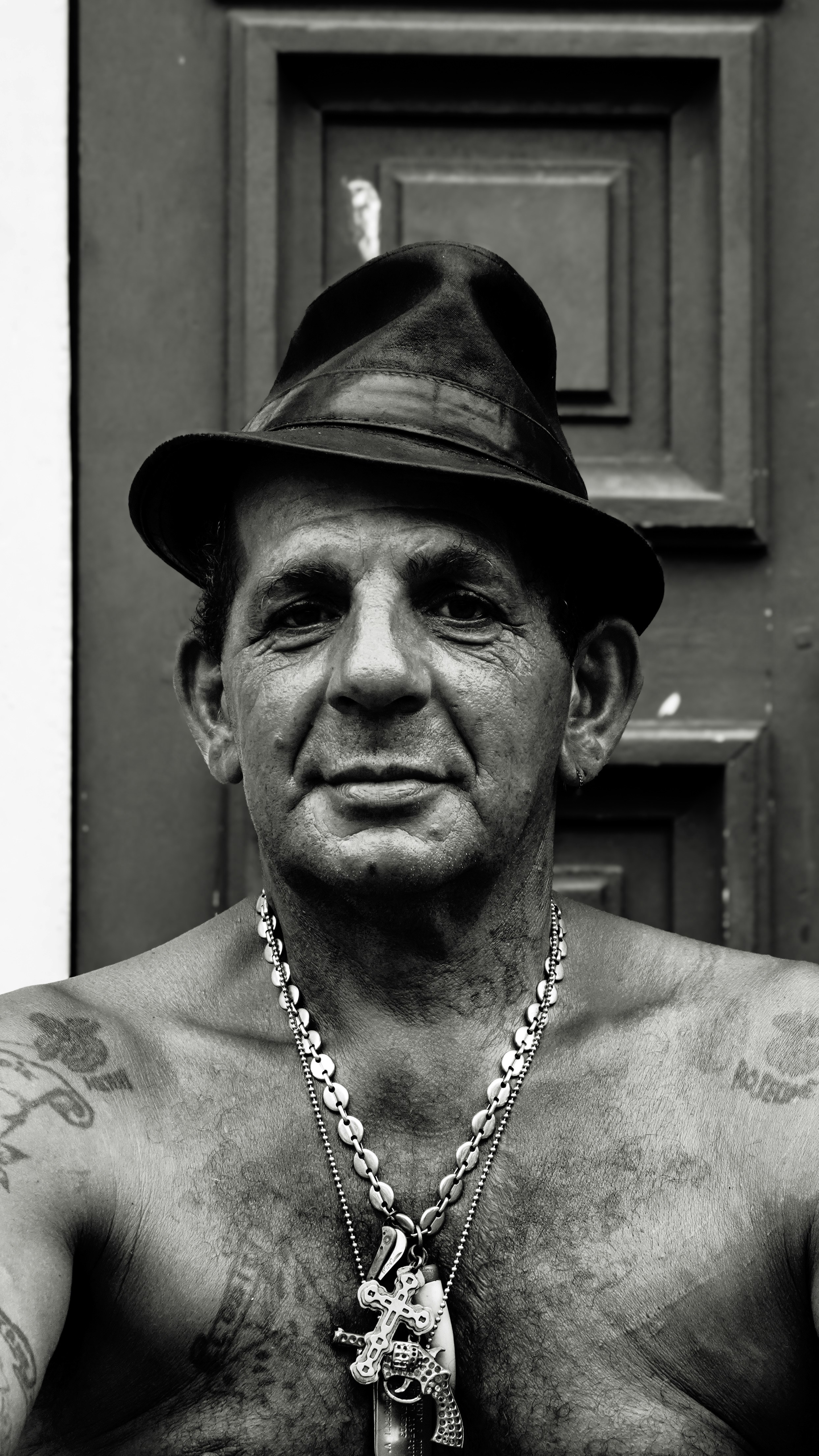 Streetwise Grit: A Tattooed Portrait in Monochrome