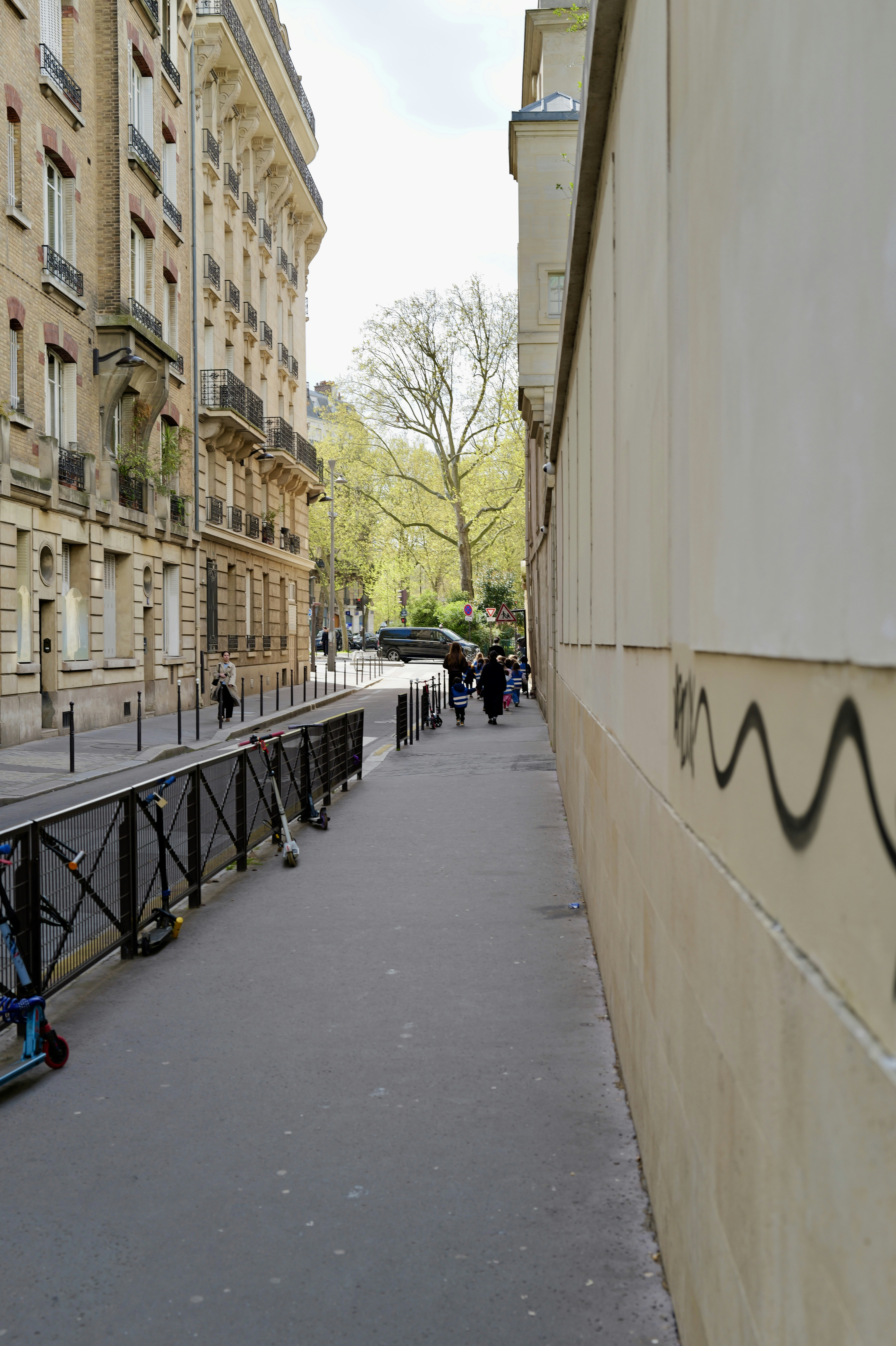 Sunlit Parisian Street Corridor