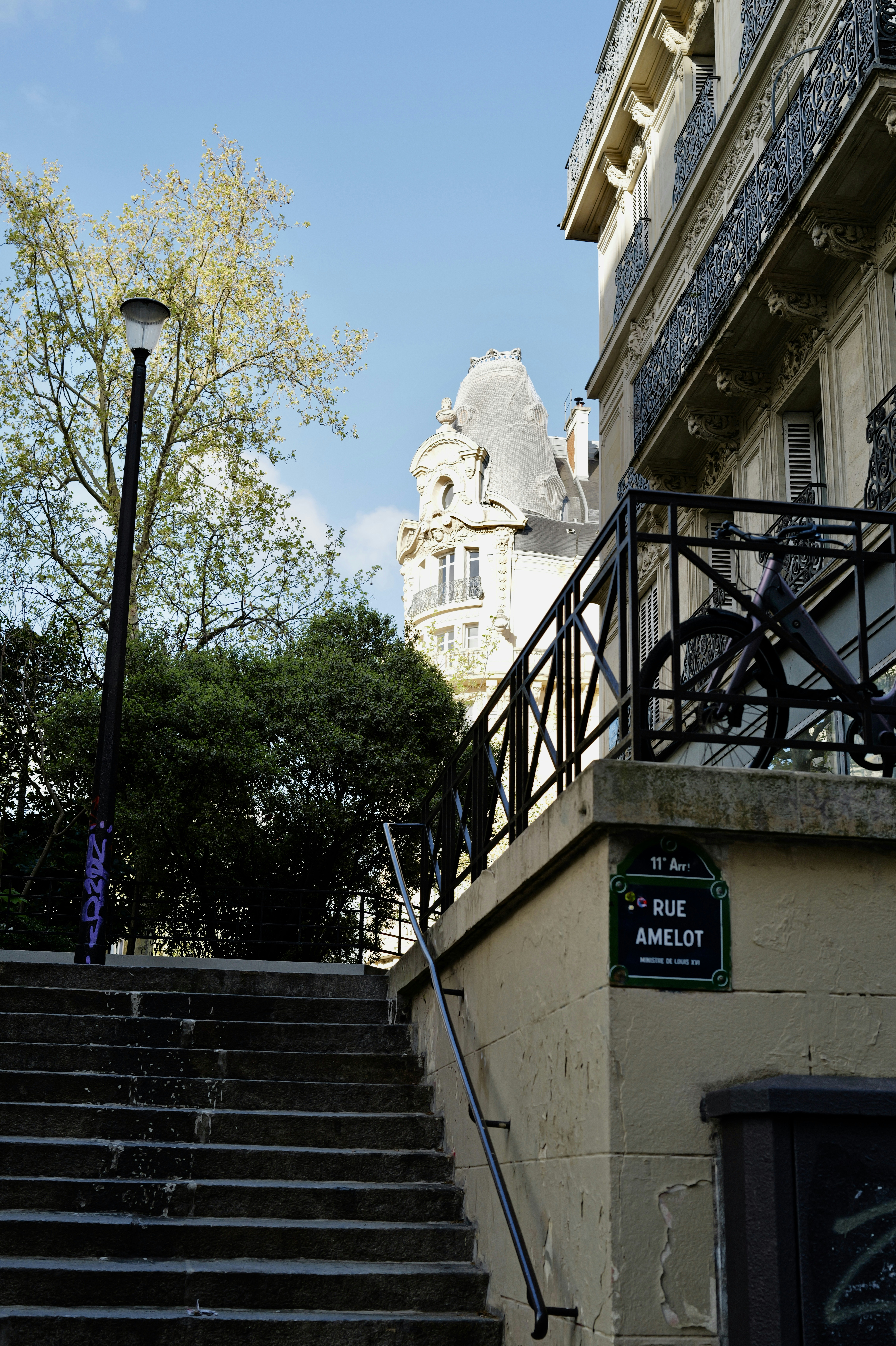 Parisian Street Staircase toward a Corner Balcony
