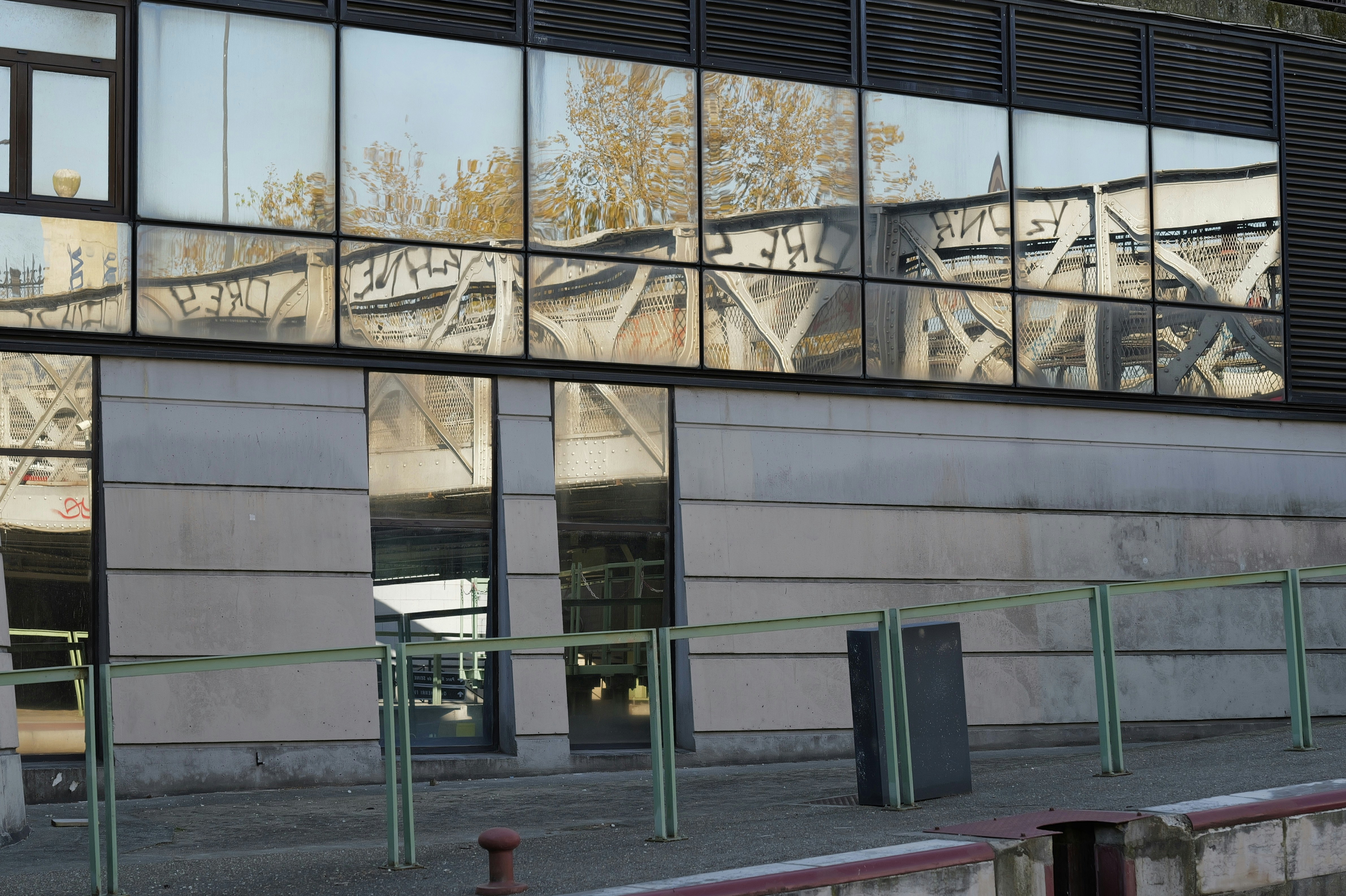 Glass Facade Echoes of a Bridge Sky