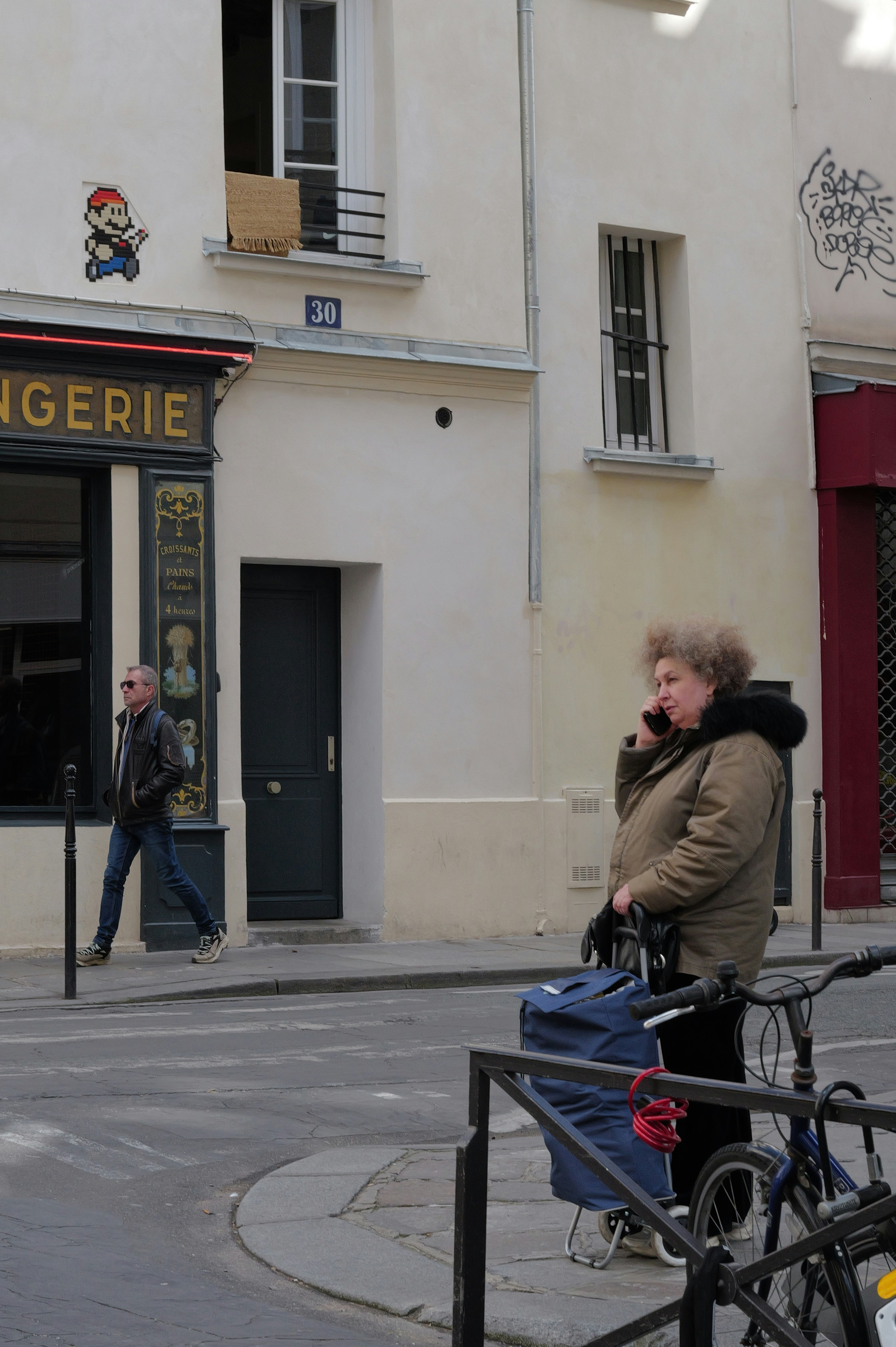 Street Moment: Neighbor in Brown Parka and a City Corner
