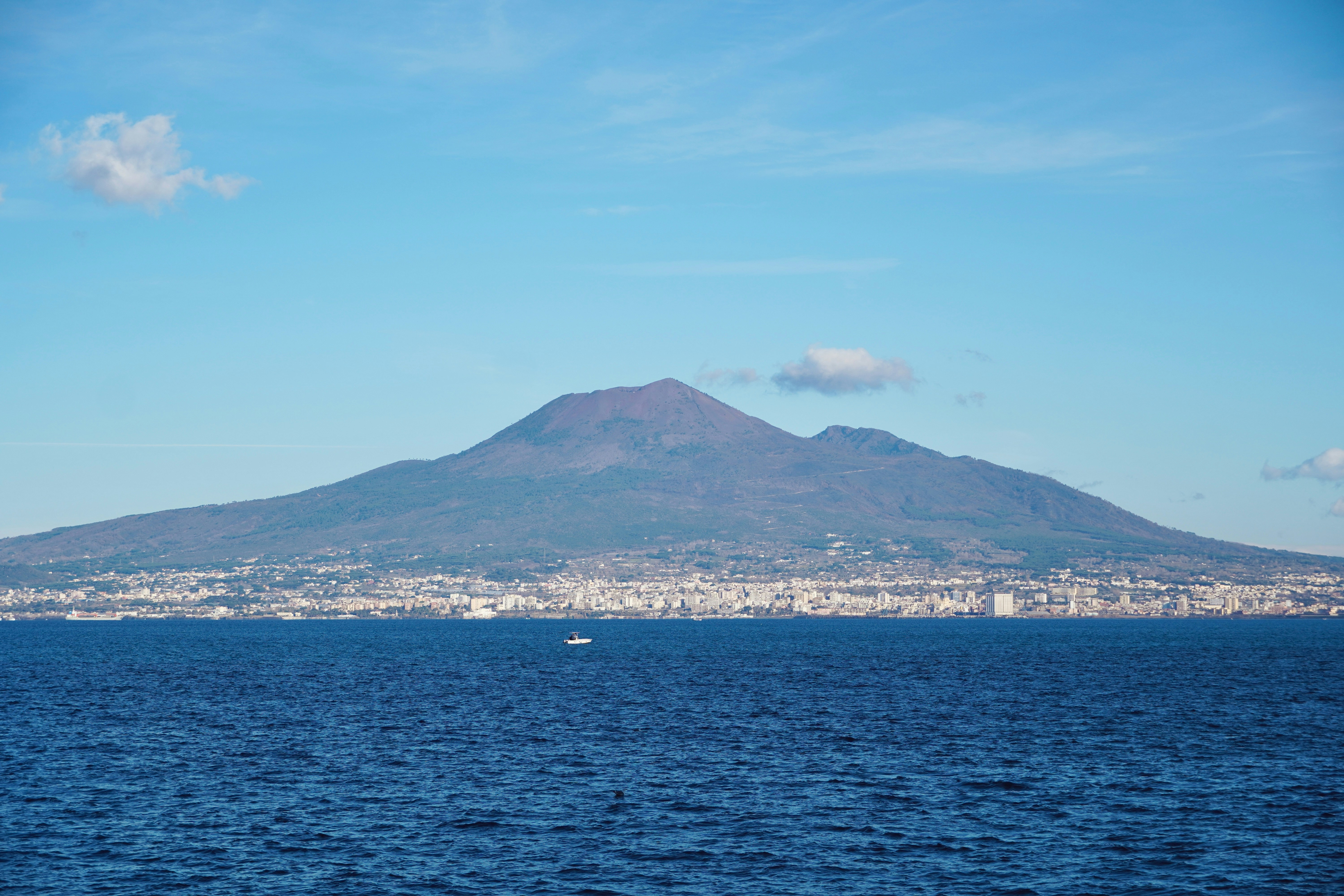 Coastal Volcano Rising Beyond the Calm Sea