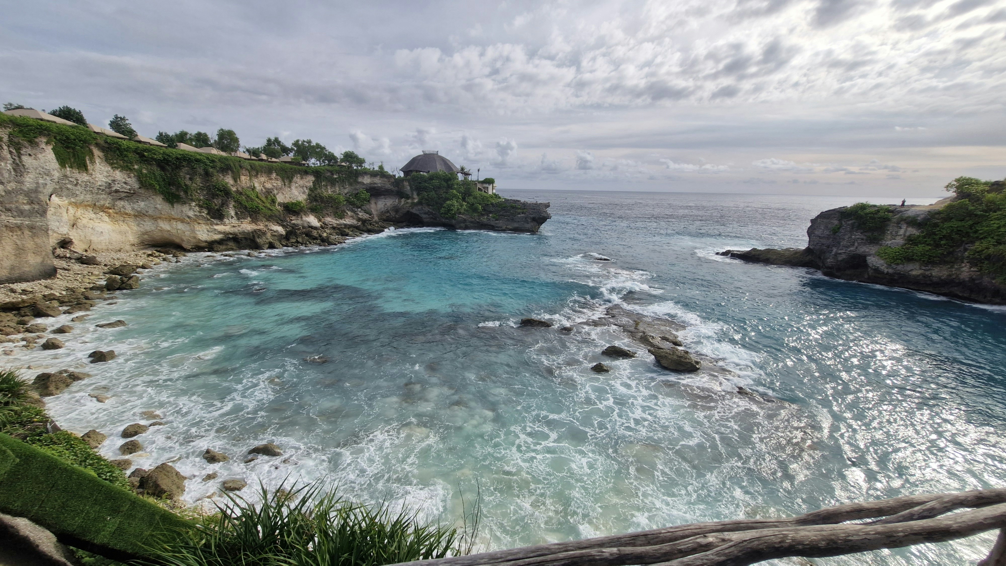  Cliffside Cove: Turquoise Tide Between Weathered Bluffs