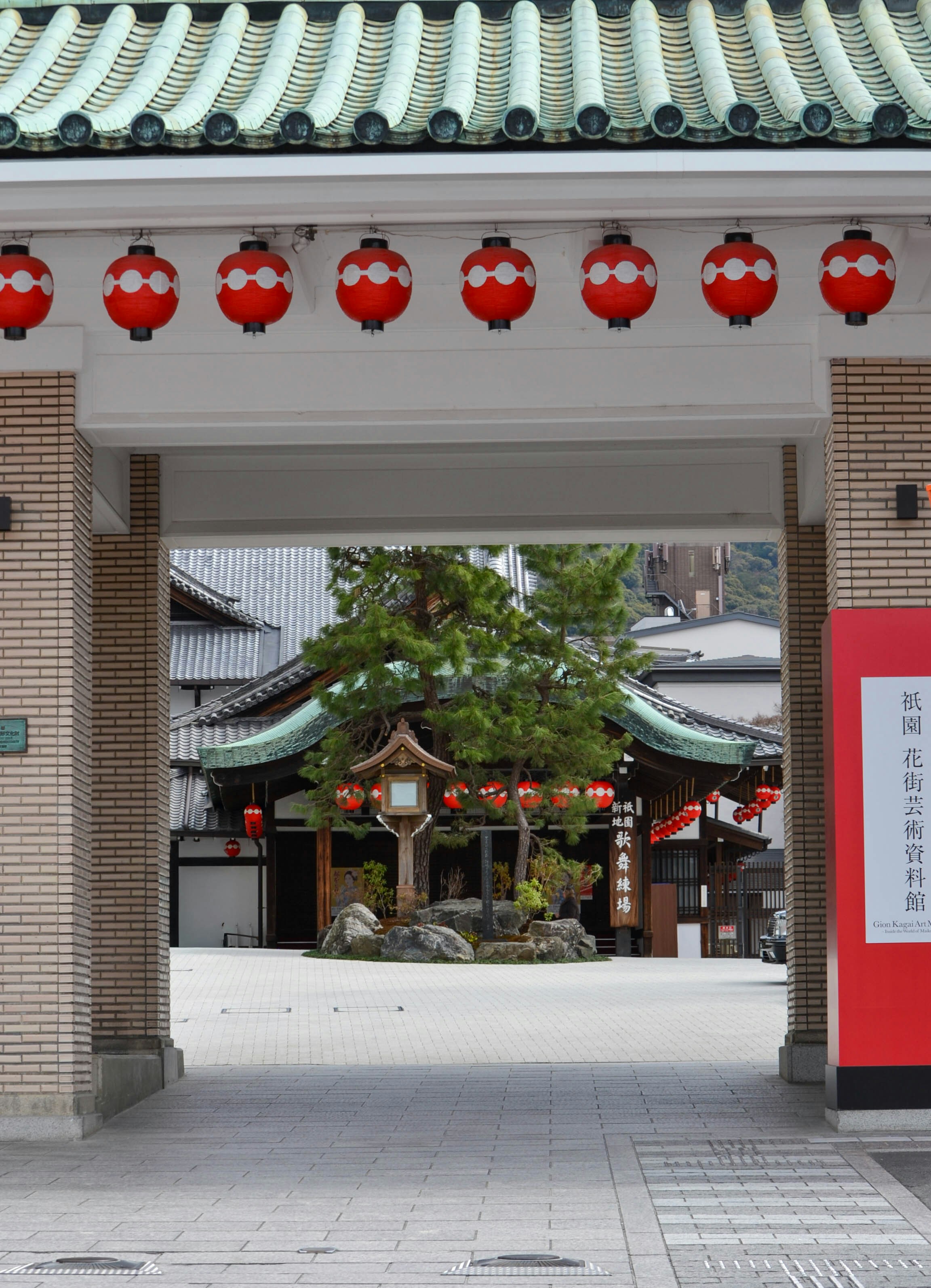 Temple Gate Portrait: Lanterns, Roofs, and Lantern-lit Courtyard